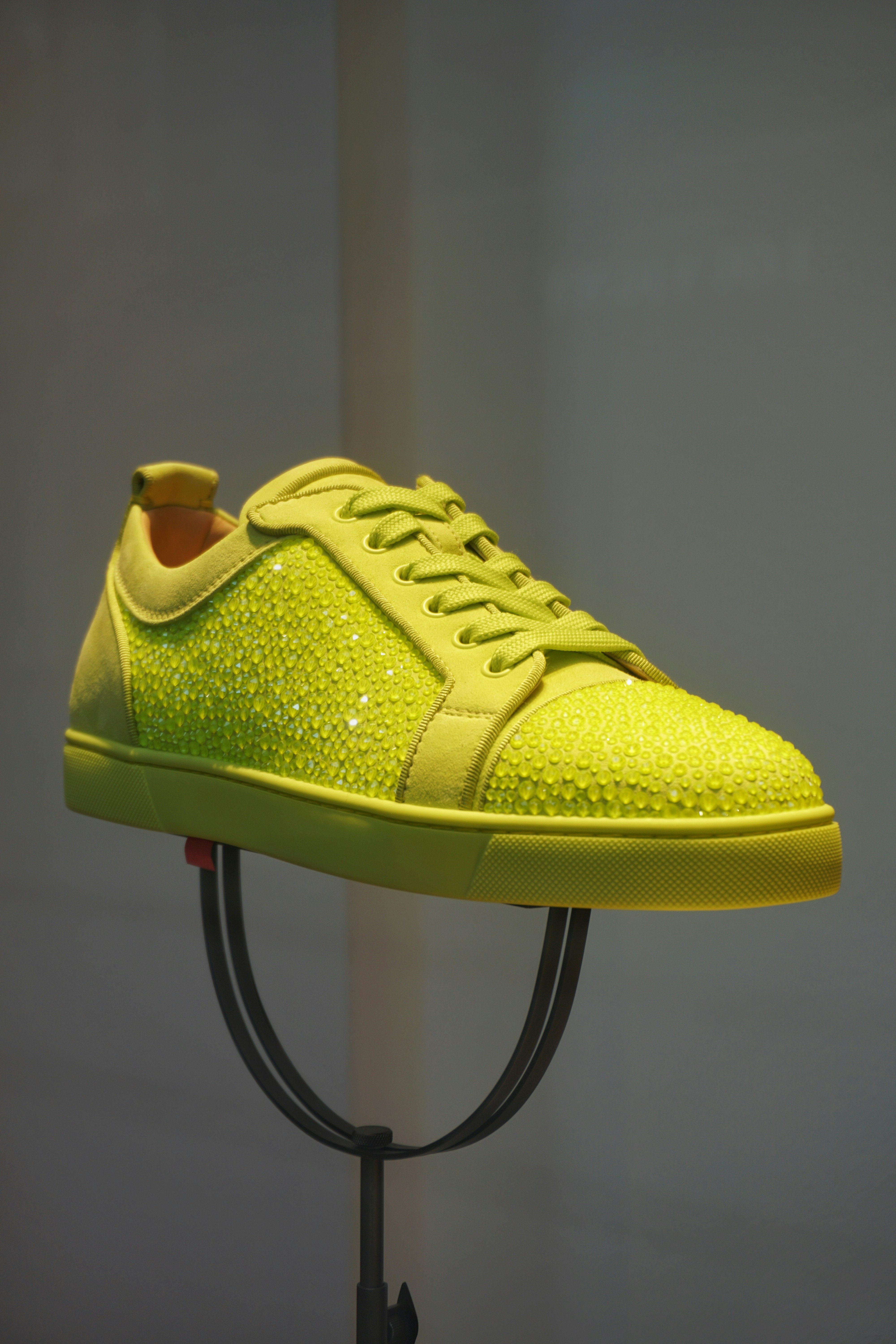 Neon Sole on Display: A Vibrant Yellow Sneaker Archive