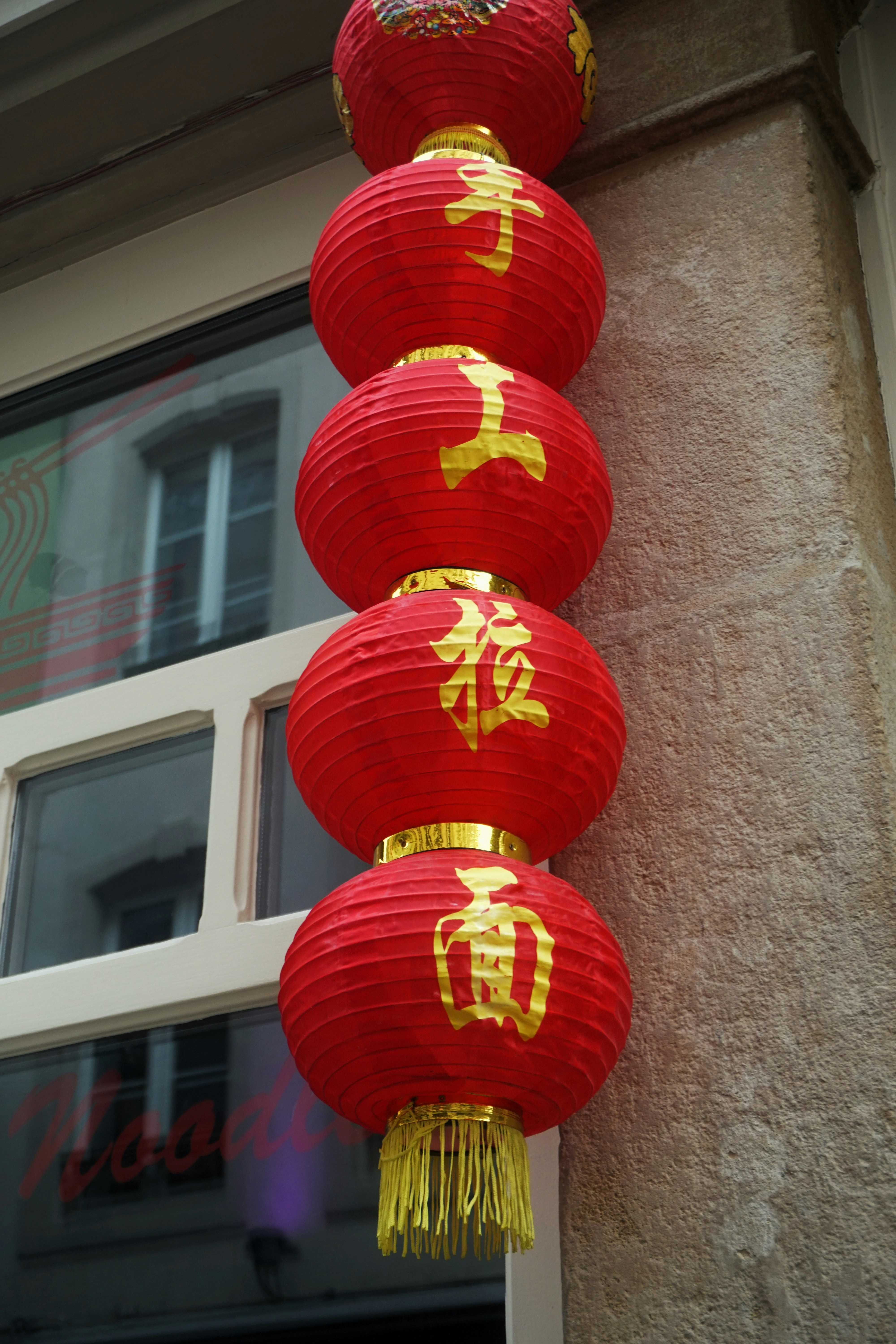 red and yellow balloons on window