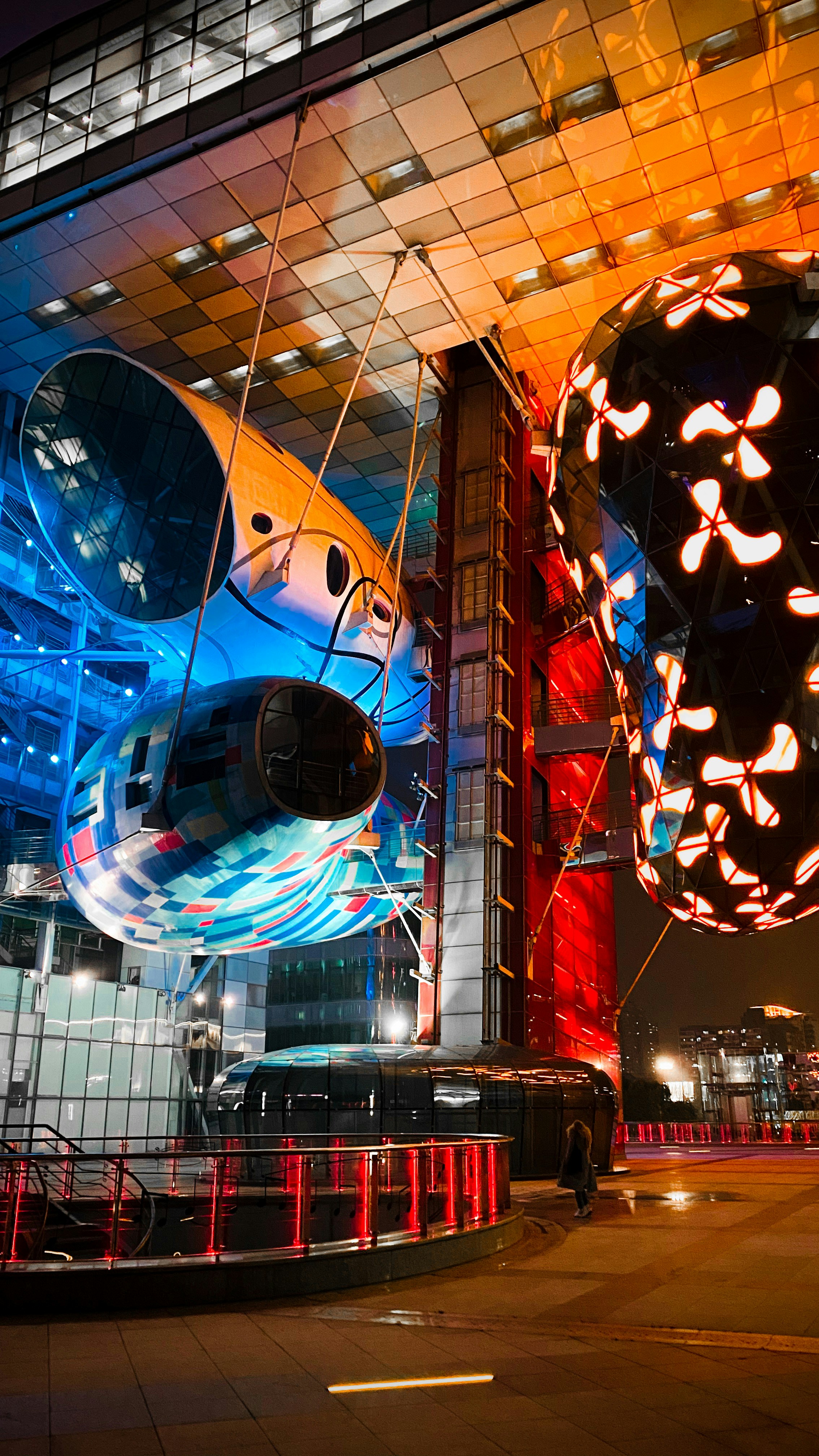 Colored Giants in the Night Sky: Orbiting Pods at Marina Bay