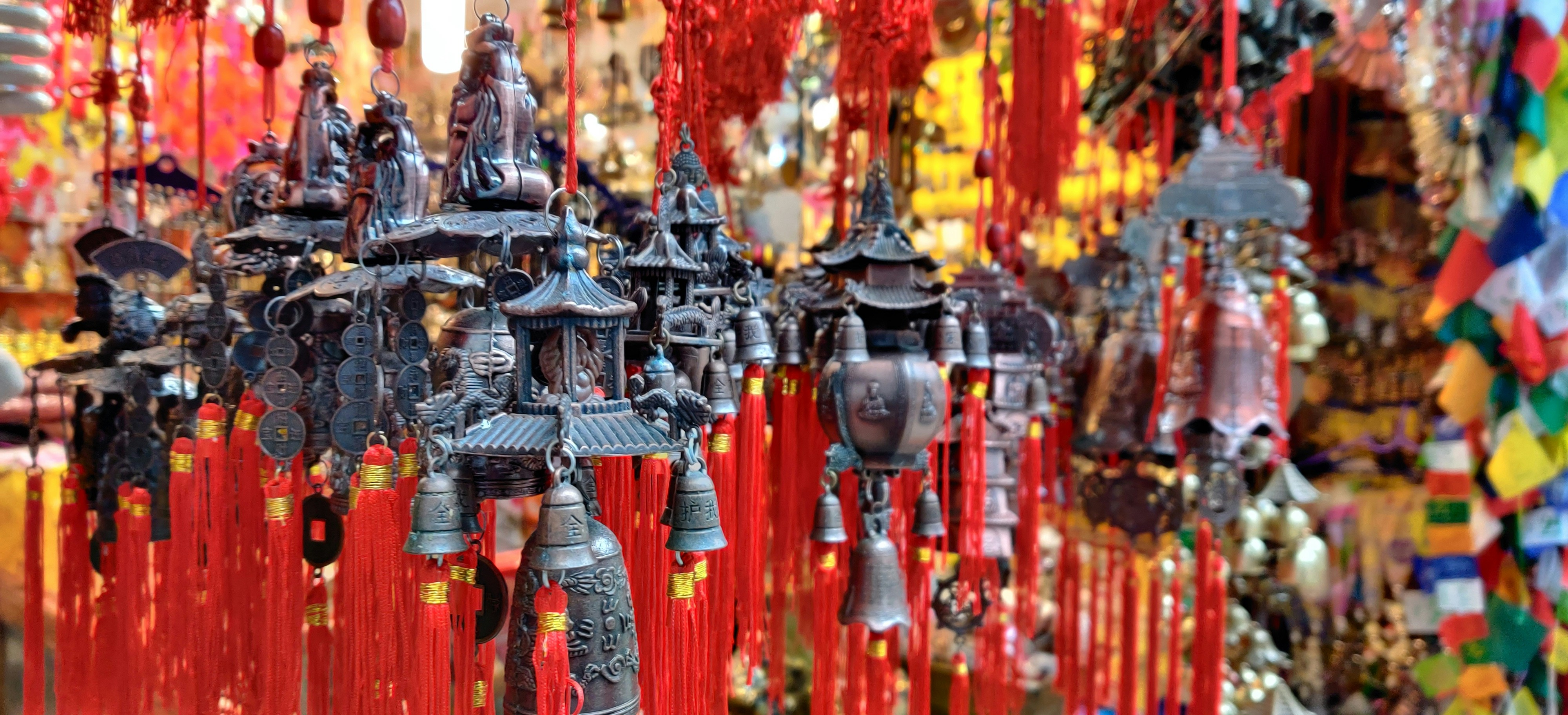 Red Lantern Forest Framing a Cluster of Silver Pagodas