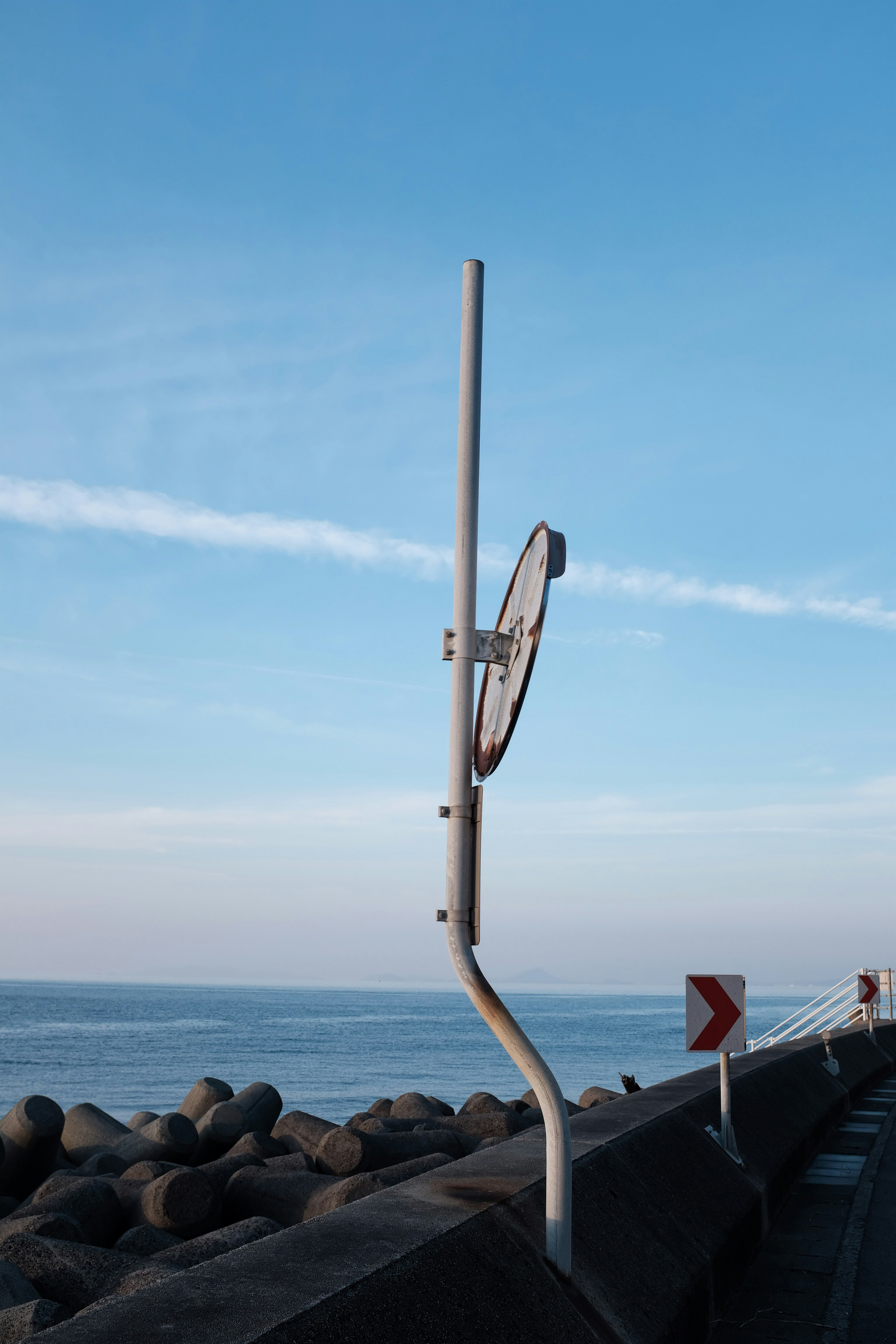 Coastal Signpost Stretches Toward the Horizon