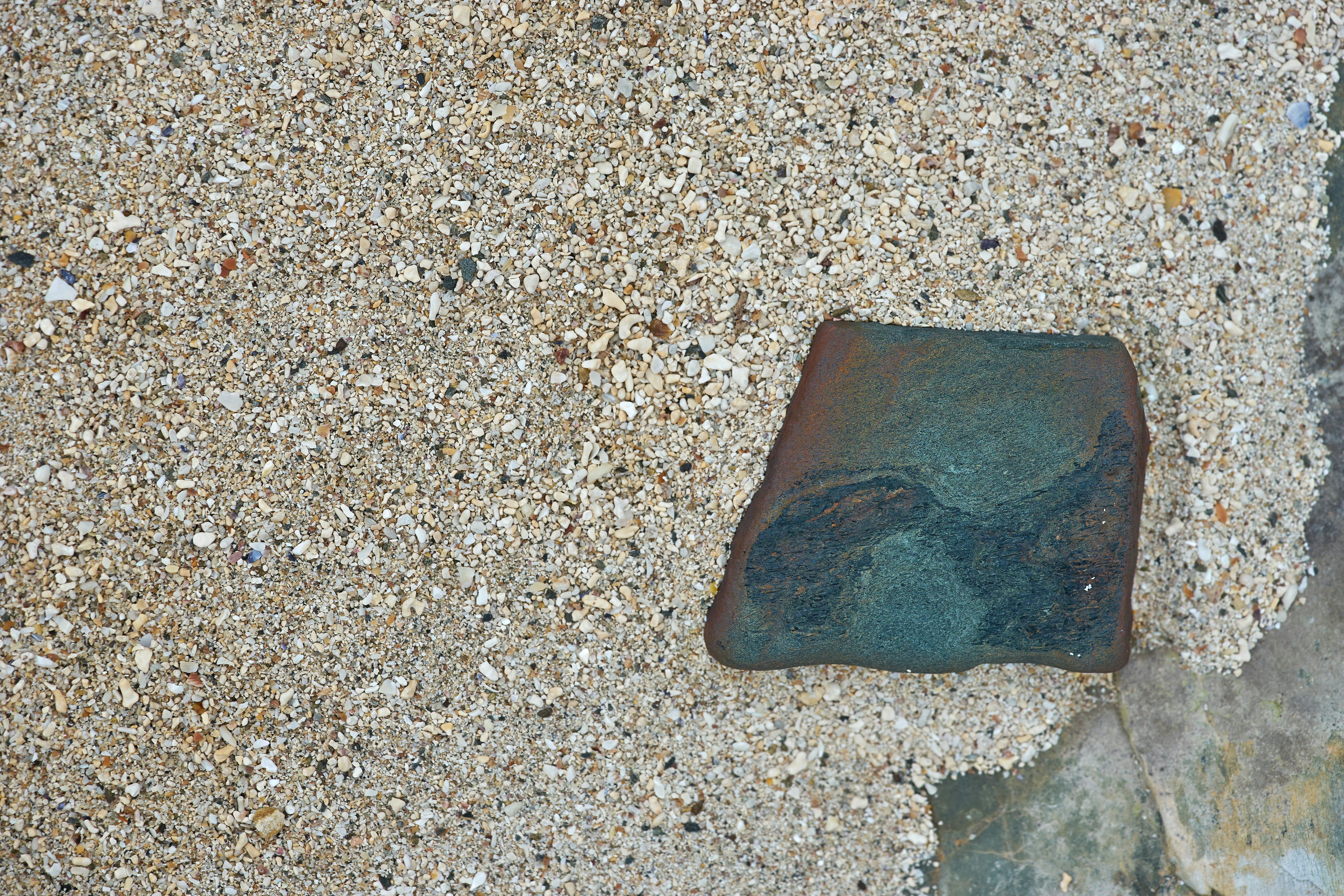 Patinaed Square on a Pebble Bed