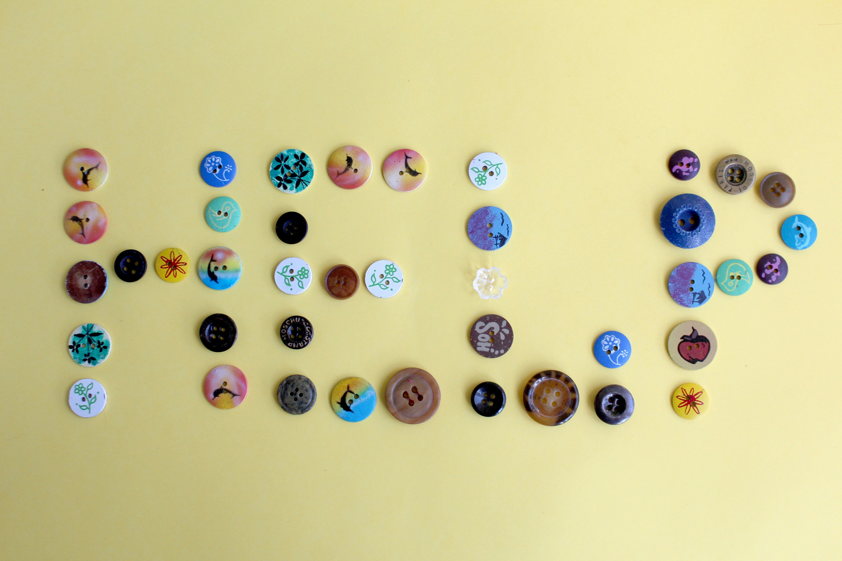 LOVE in Buttons: A Sunny Typographic Mosaic