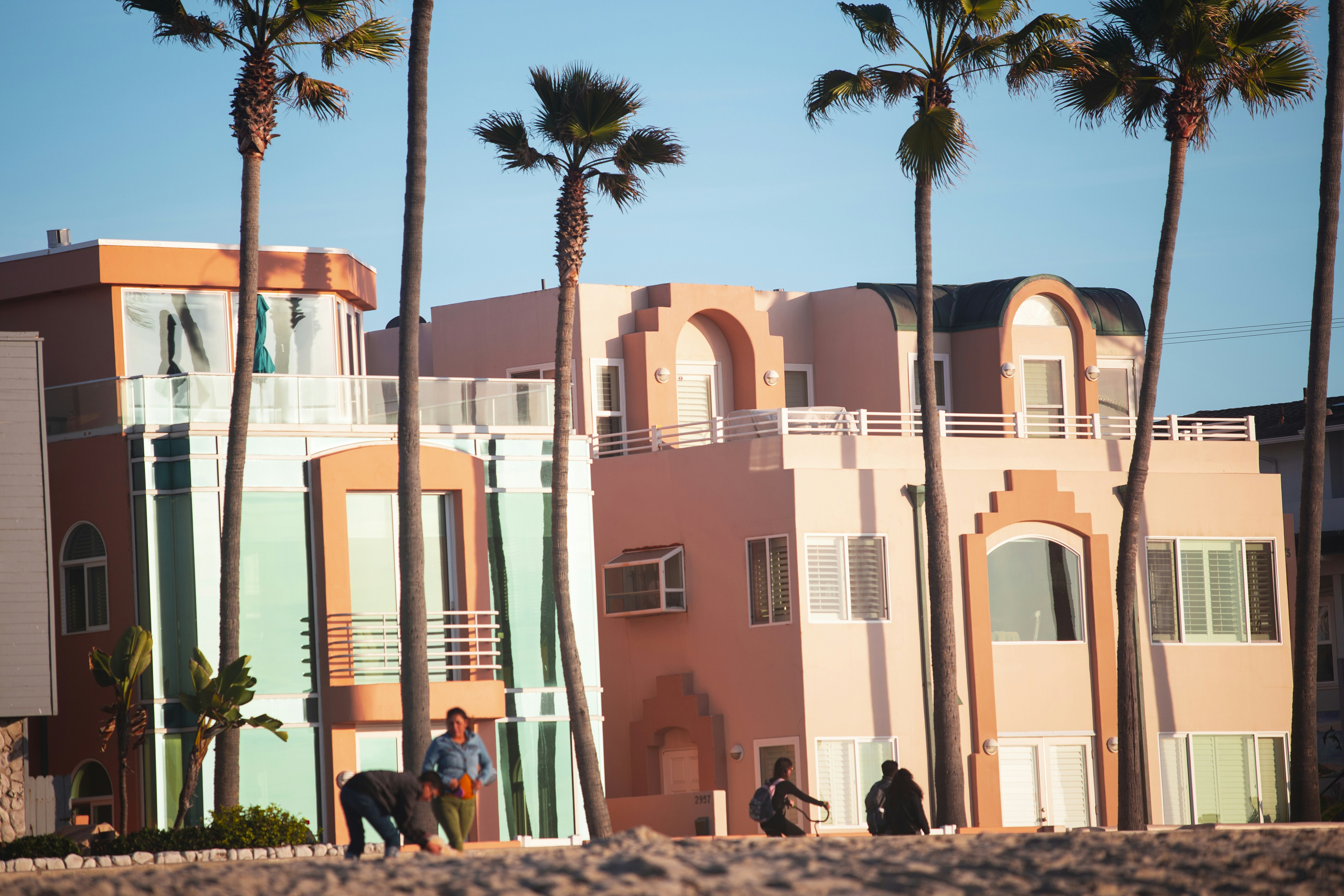 People sitting on bench near building during daytime photo – Free ...