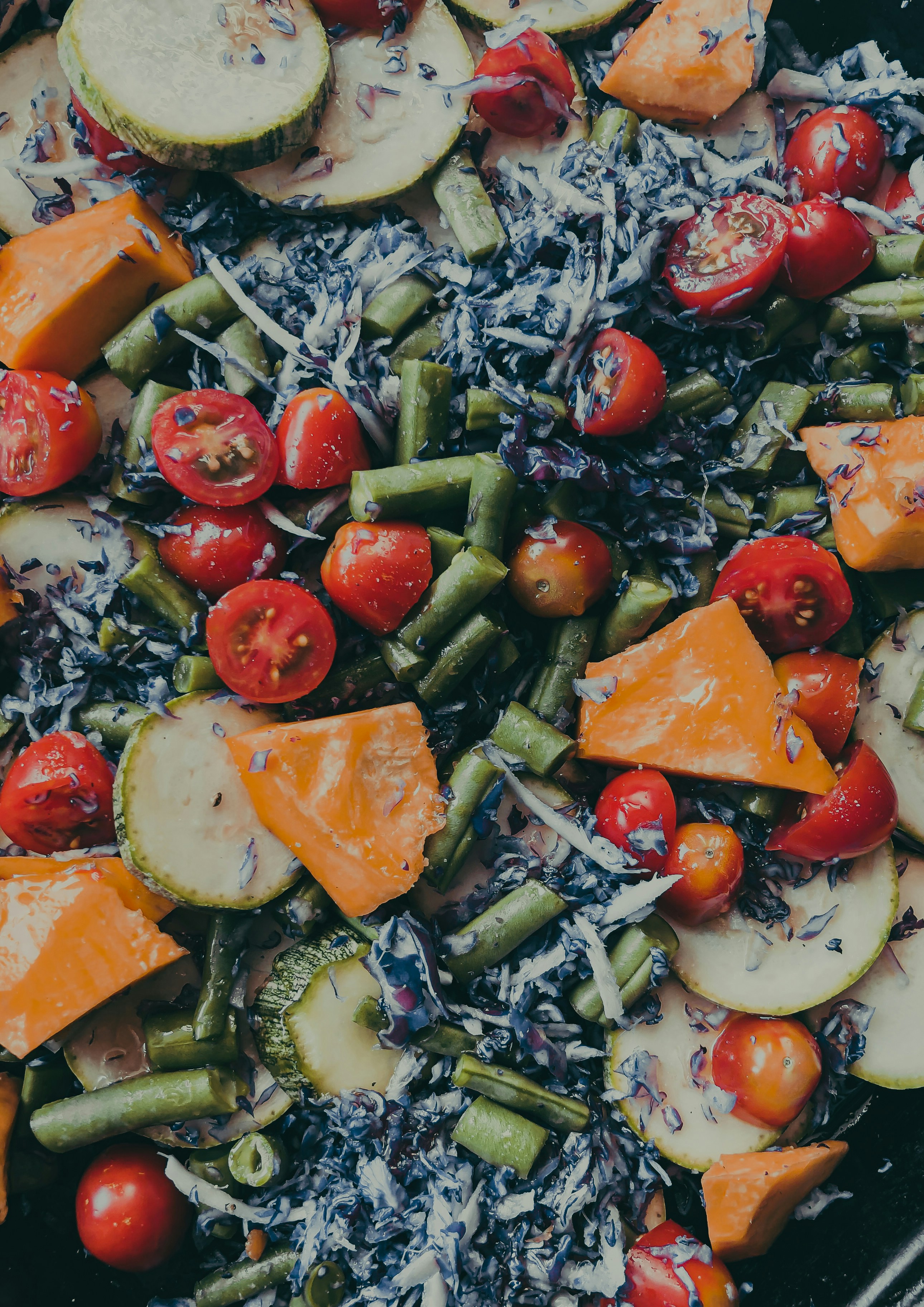 Colorful Veggie Mosaic: Zucchini, Tomatoes, and Orange Squash in a Pan