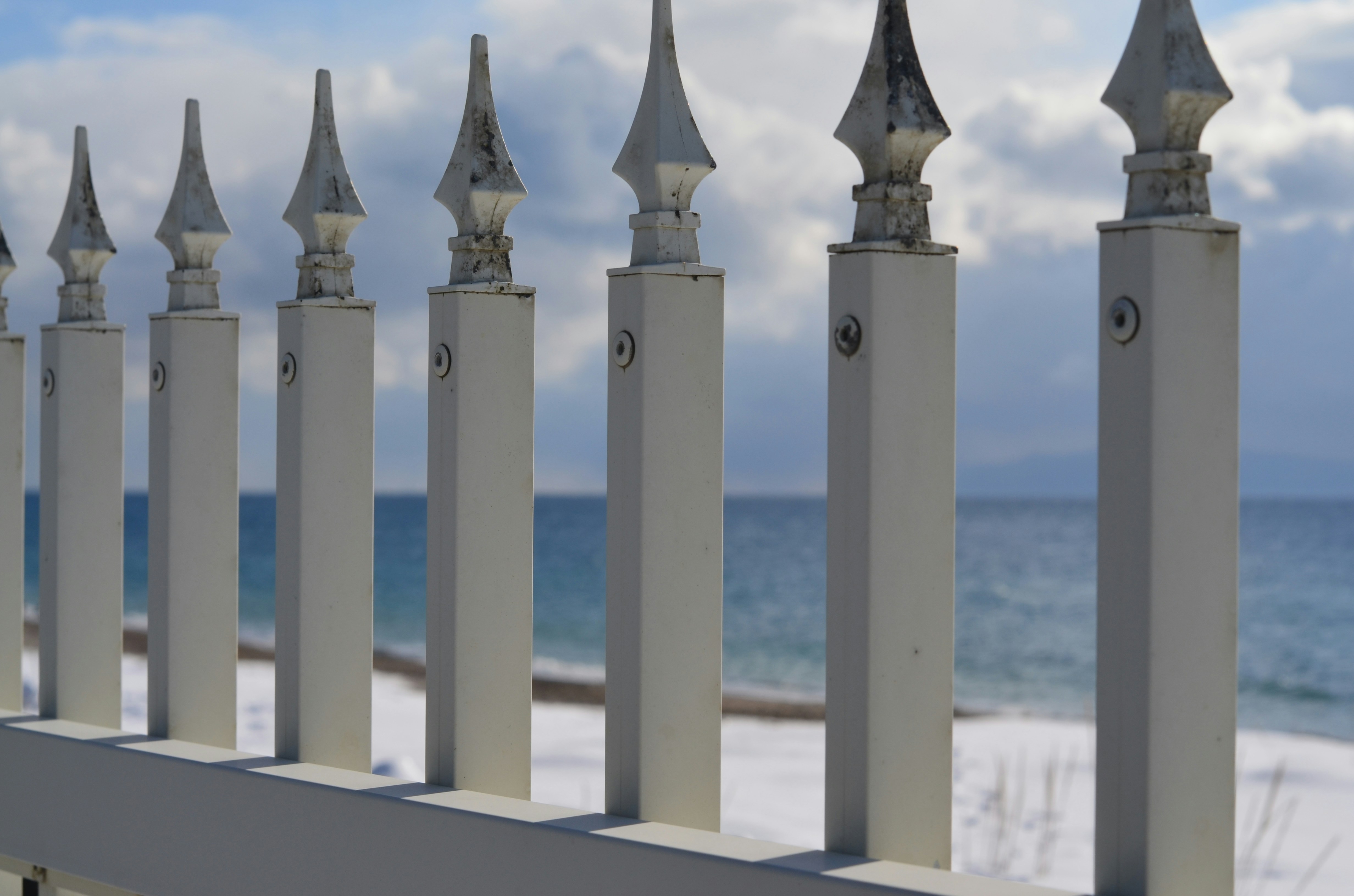 Spire-Topped Fence Framing a Quiet Atlantic