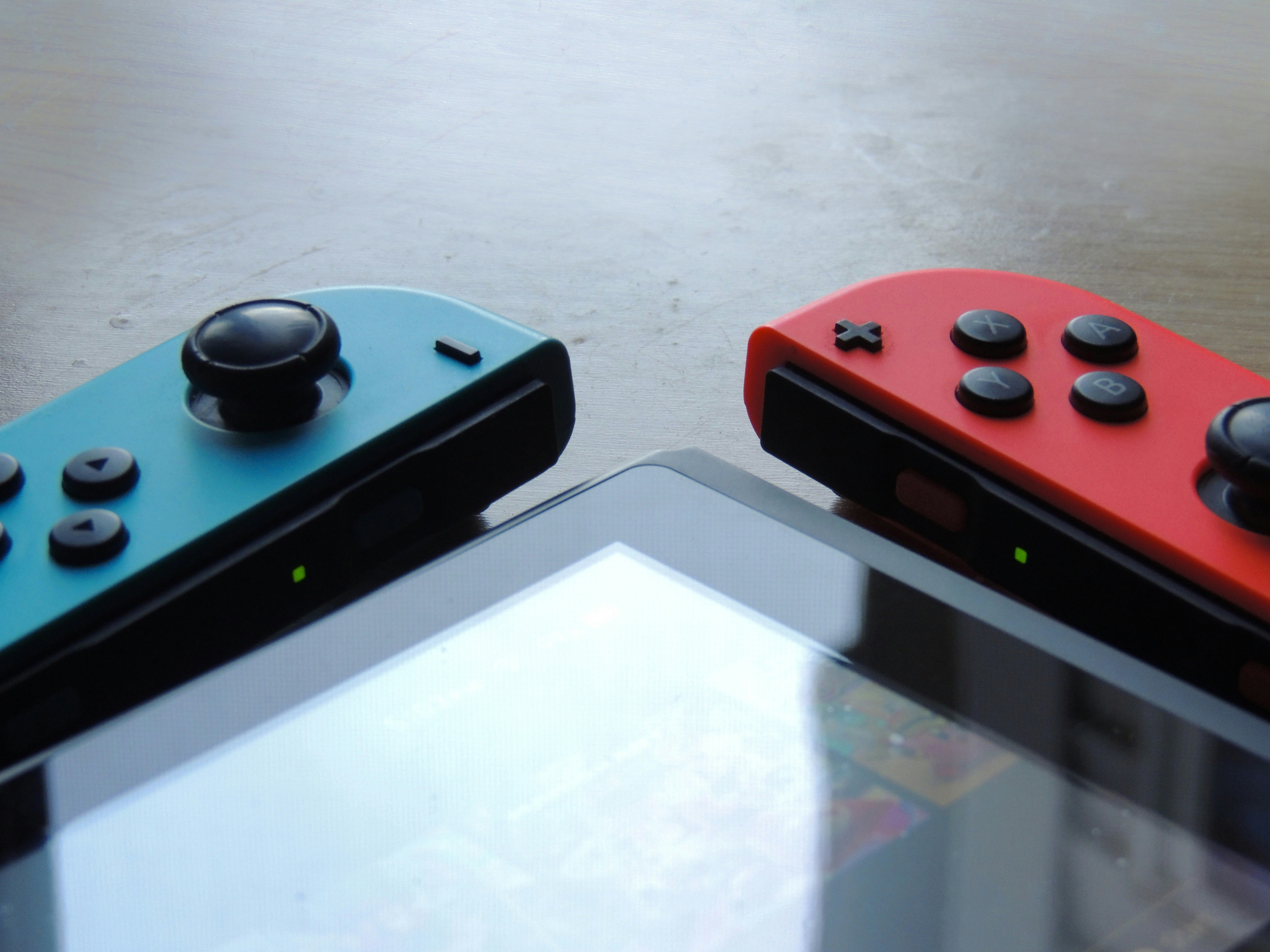 Red and black nintendo switch game console photo – Free Electronics ...