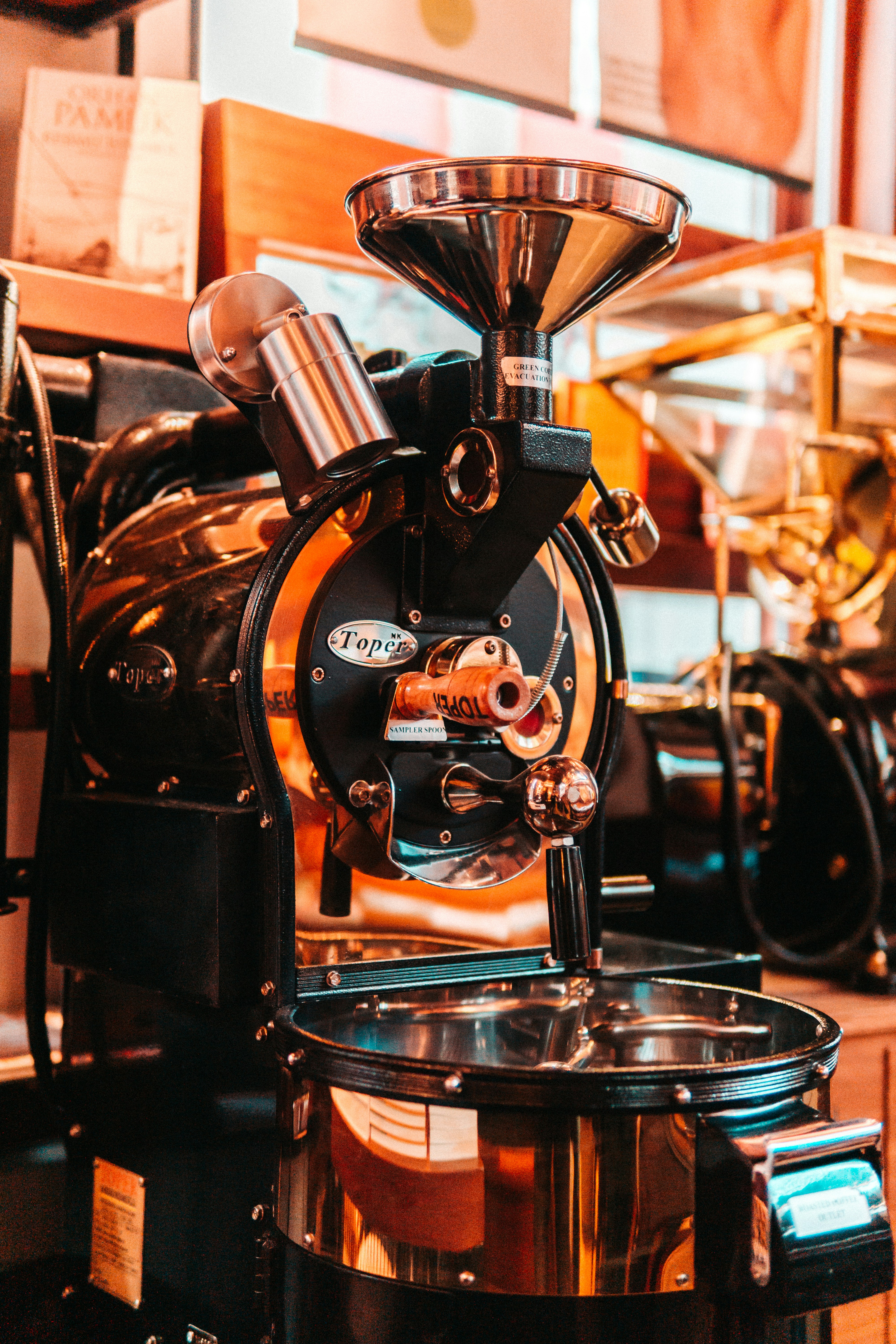 Amber Gears: A Vintage Espresso Grinder Anchored by Warm Workshop Light