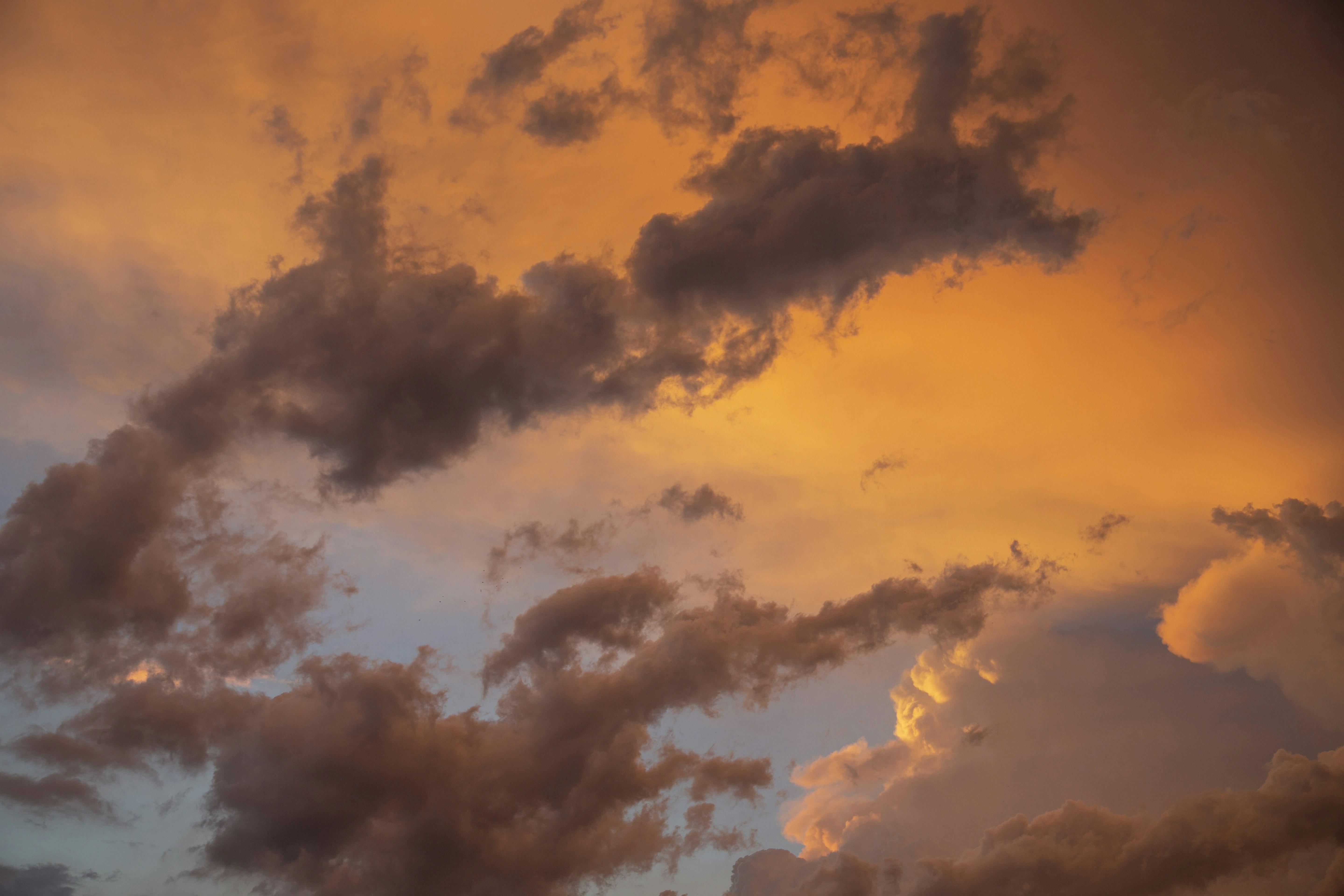 Clouds, sunset, orange and something magic | white clouds and blue sky during daytime