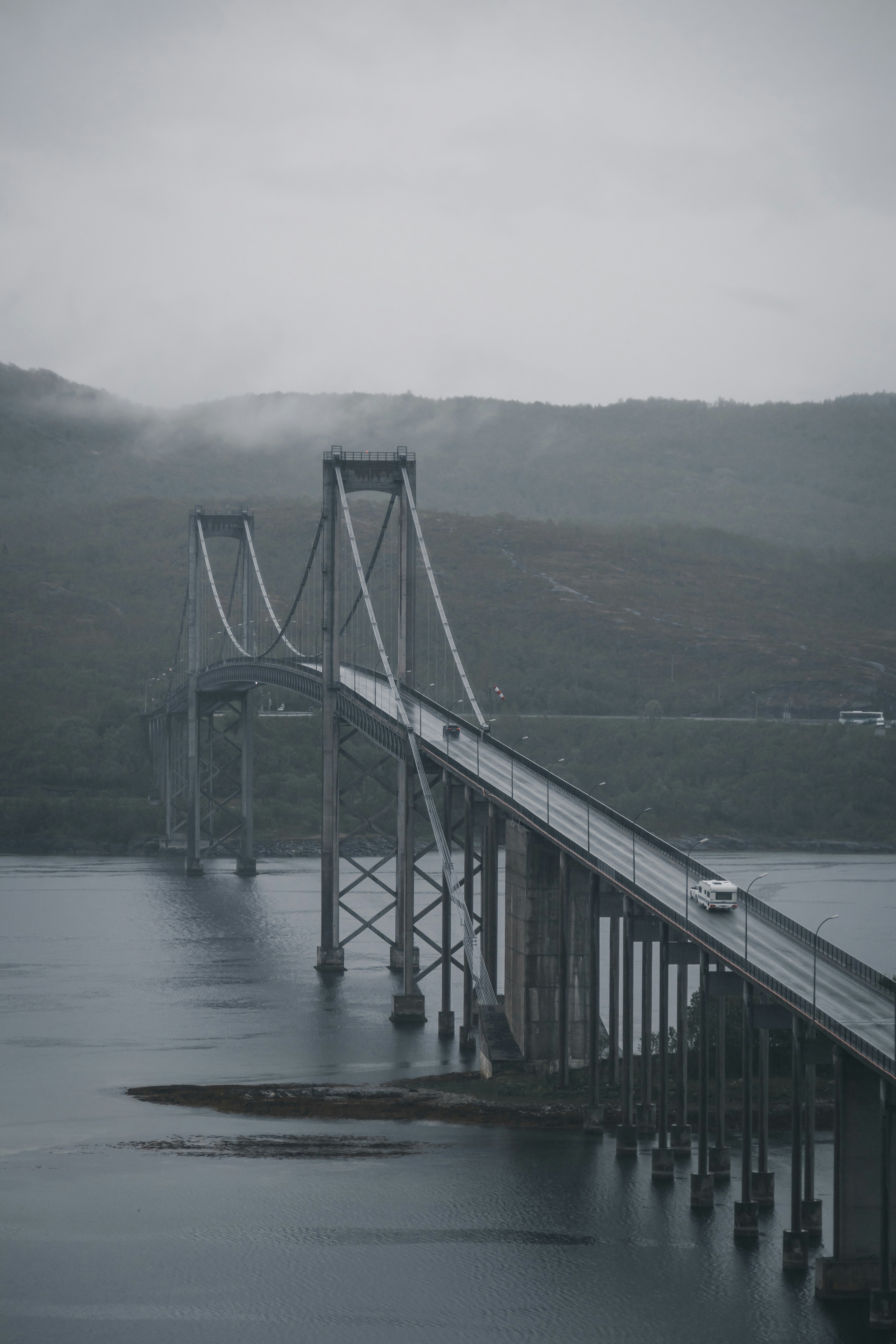 Gray bridge over body of water photo – Free Grey Image on Unsplash