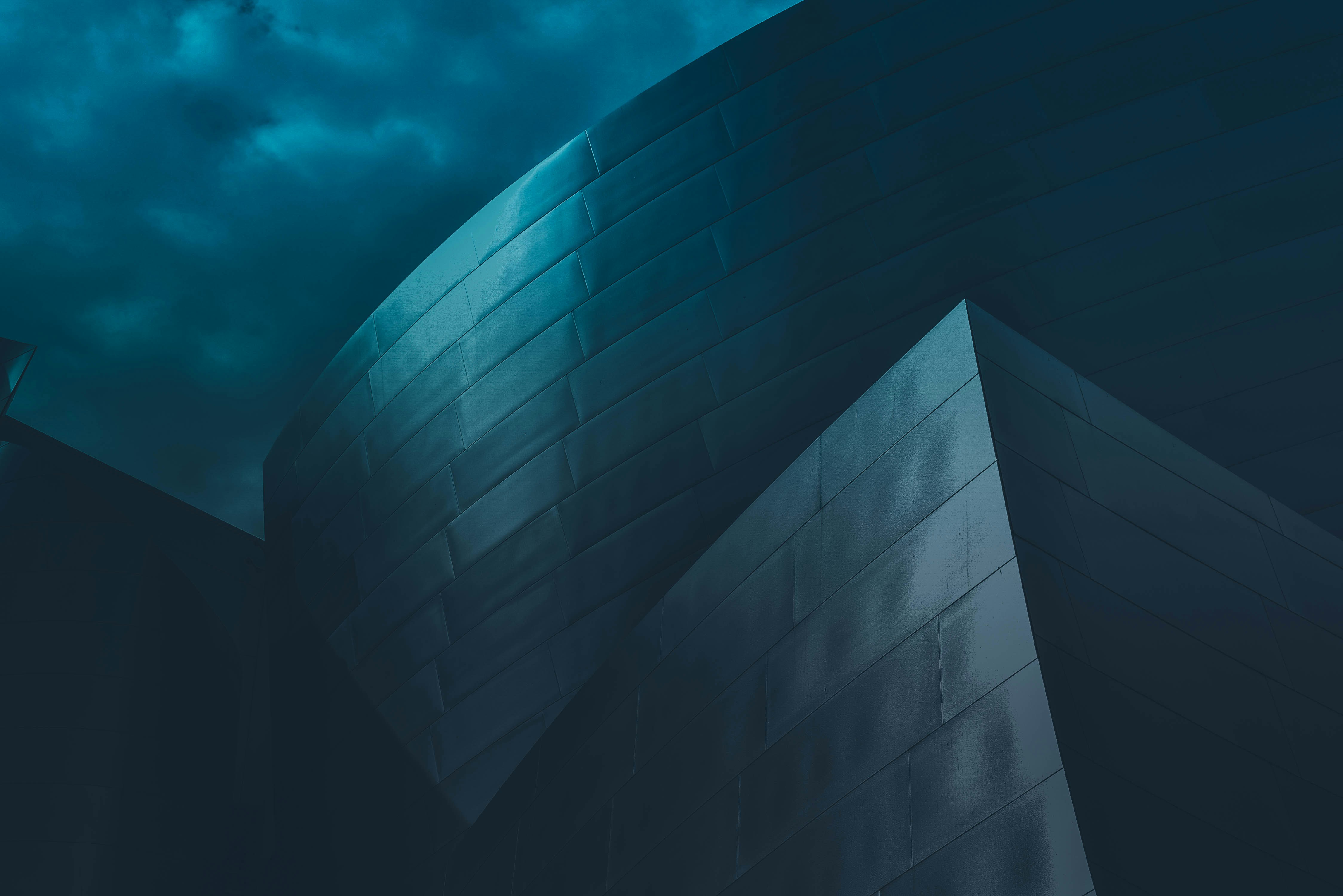 Gray concrete building under blue sky photo – Free Walt disney concert ...