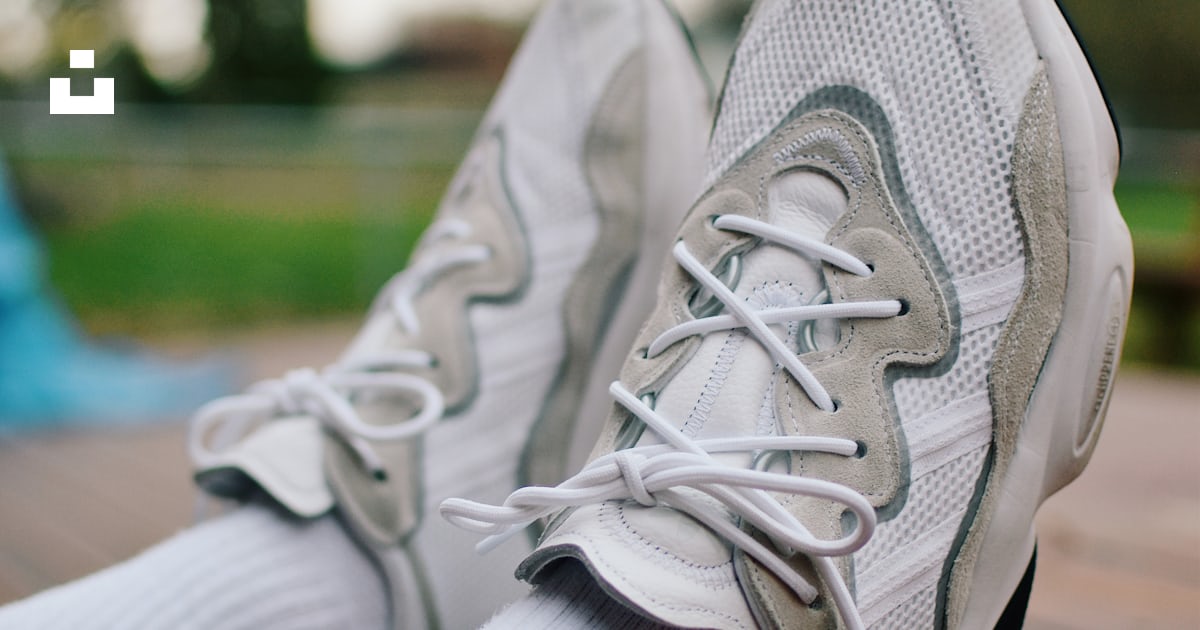 Person Wearing Gray And White Nike Athletic Shoes Photo Free