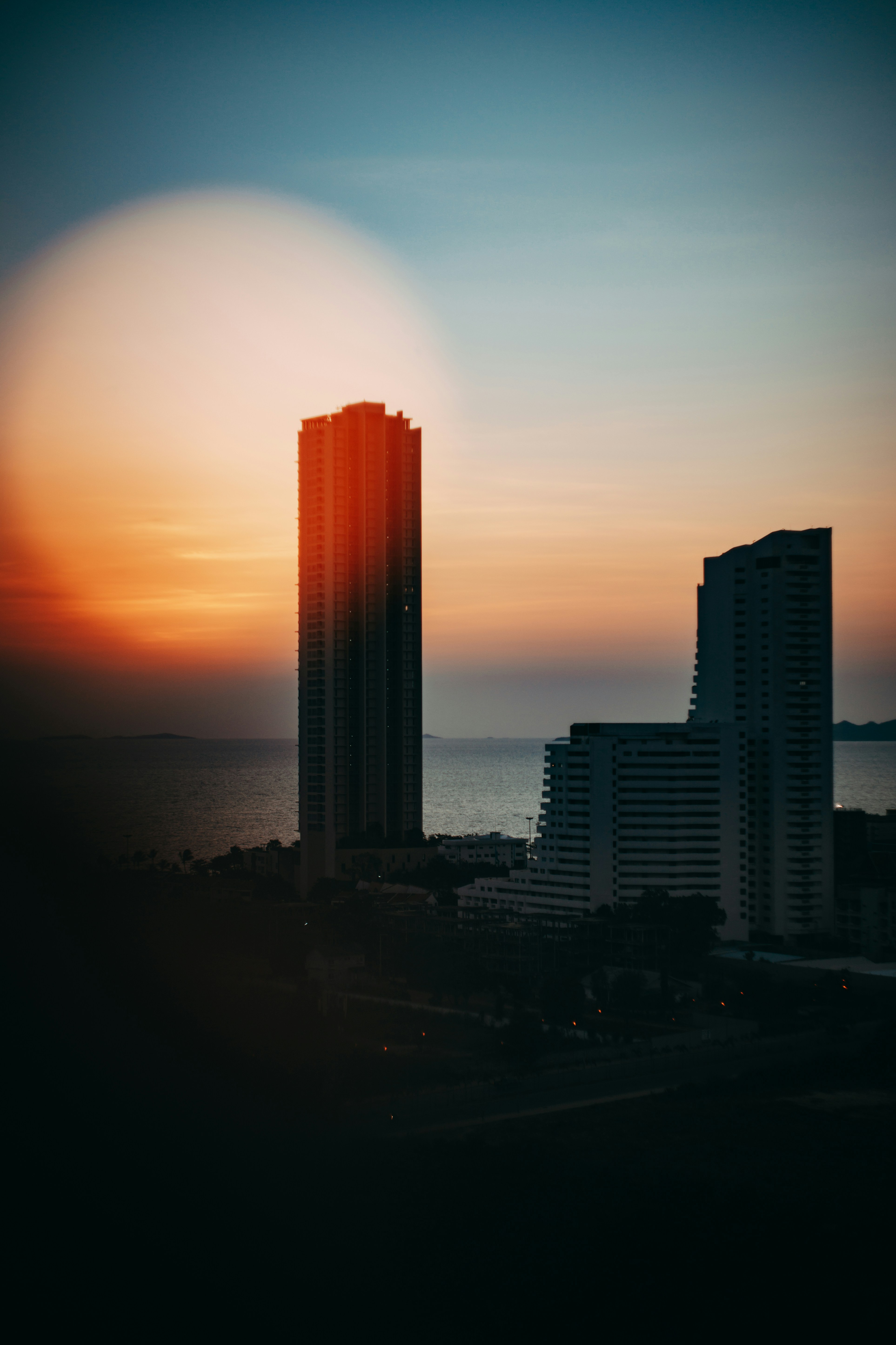 Sun Halo Over a Coastal High-Rise at Golden Hour