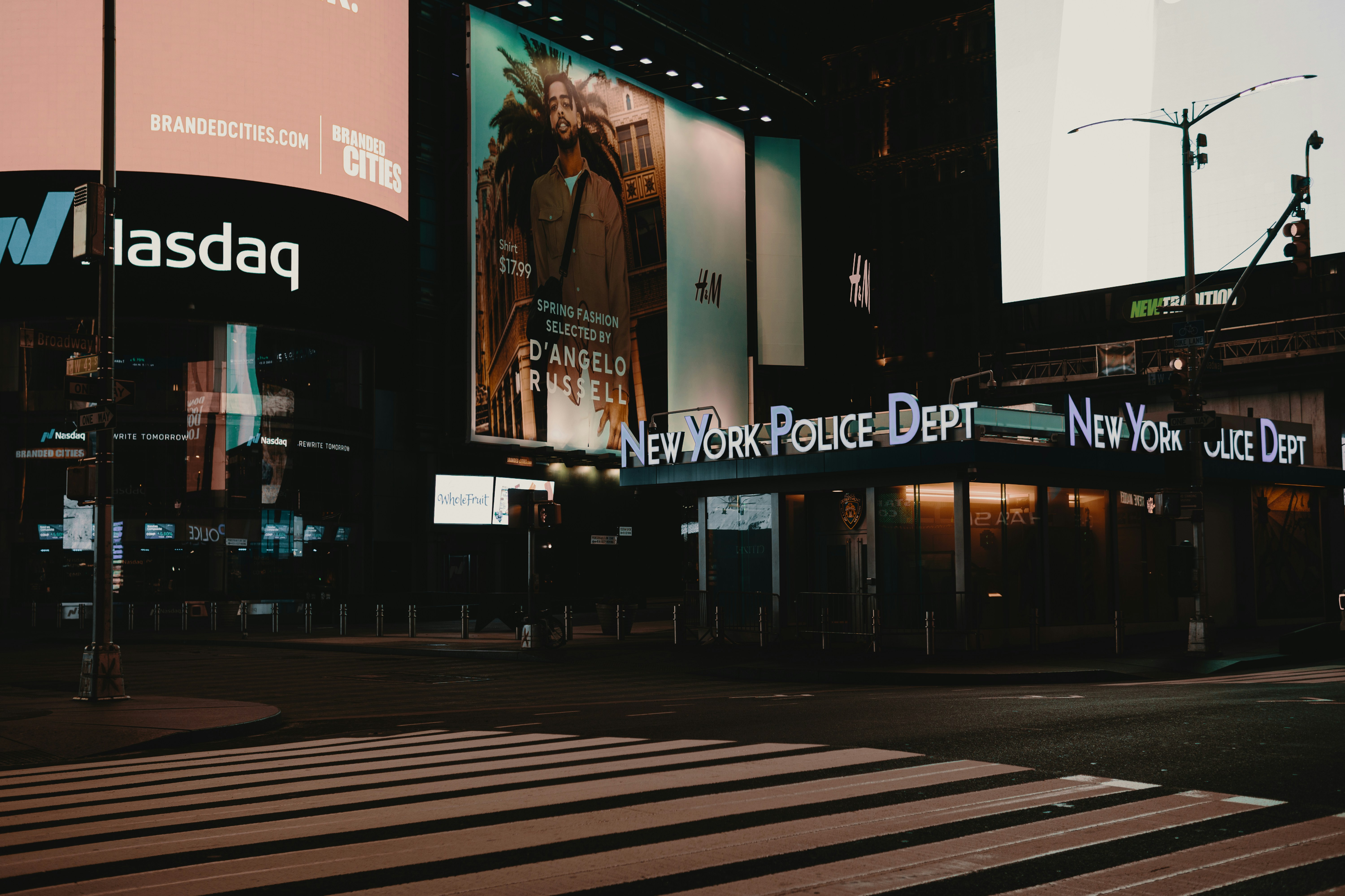 Neon Echo on a Quiet Broadway: NYPD Signage Under Night Skies