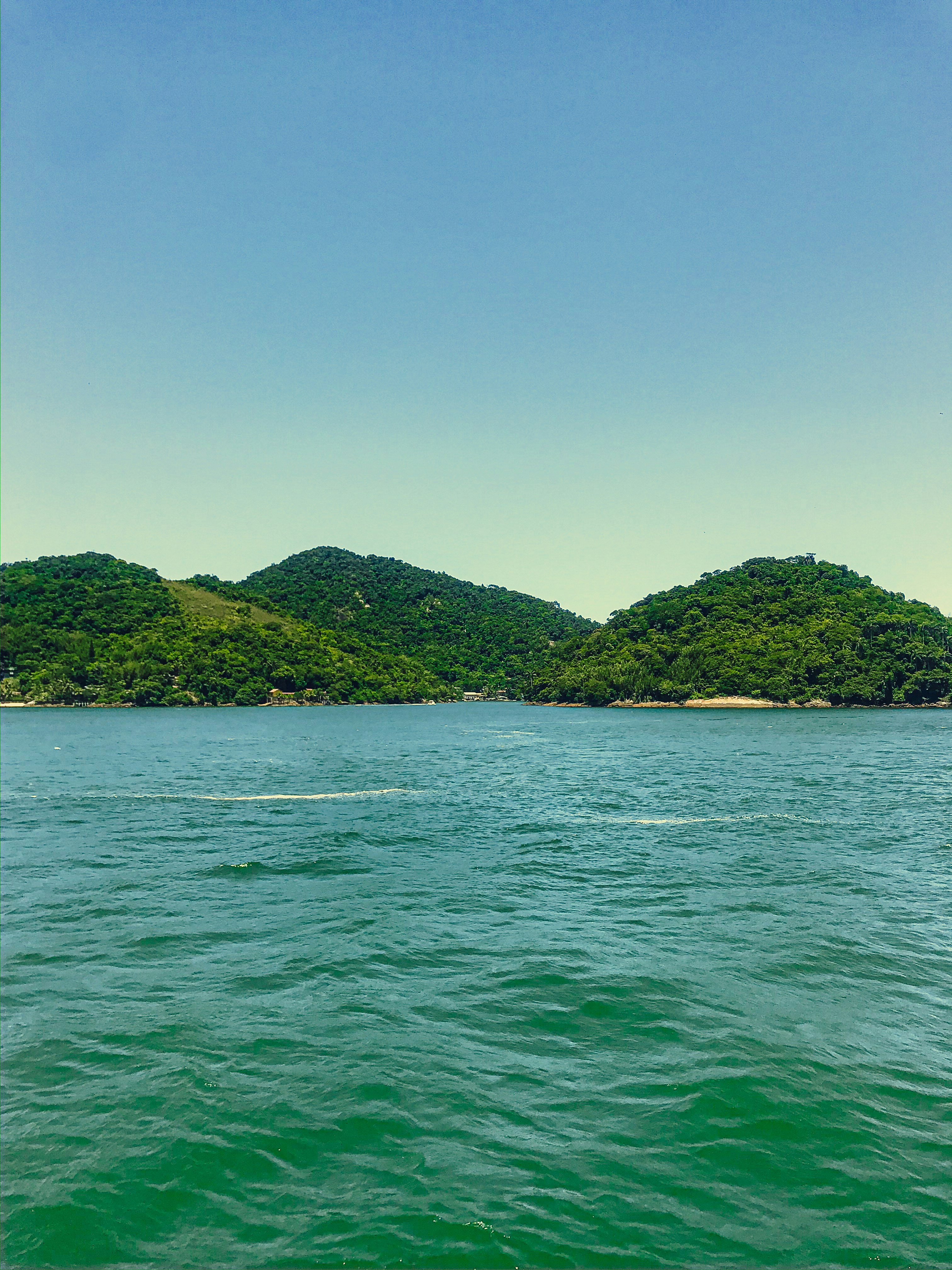 Green island in the middle of sea during daytime photo – Free Grey ...
