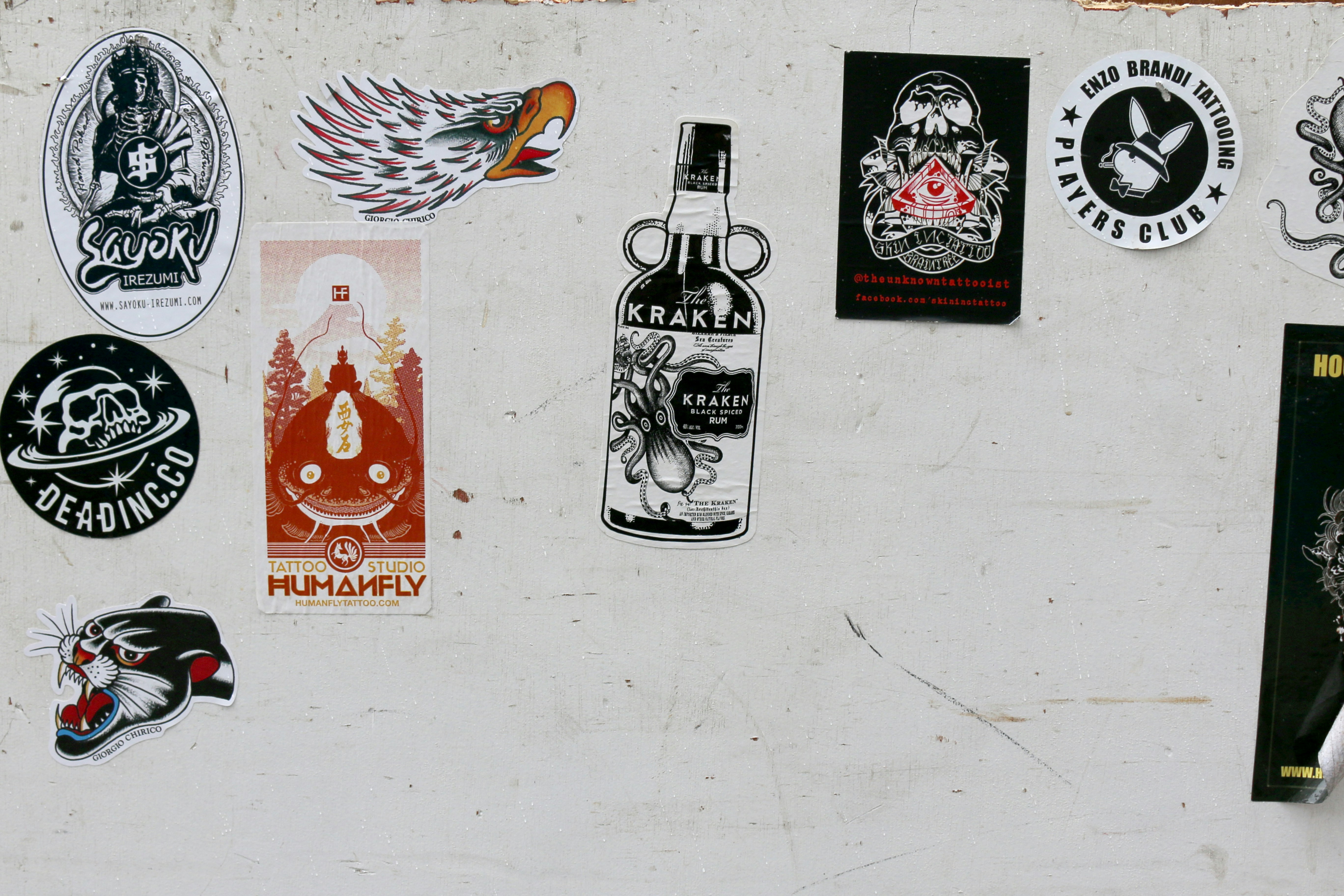 Kraken on a Sticker Wall: A Tiny Urban Gallery in White