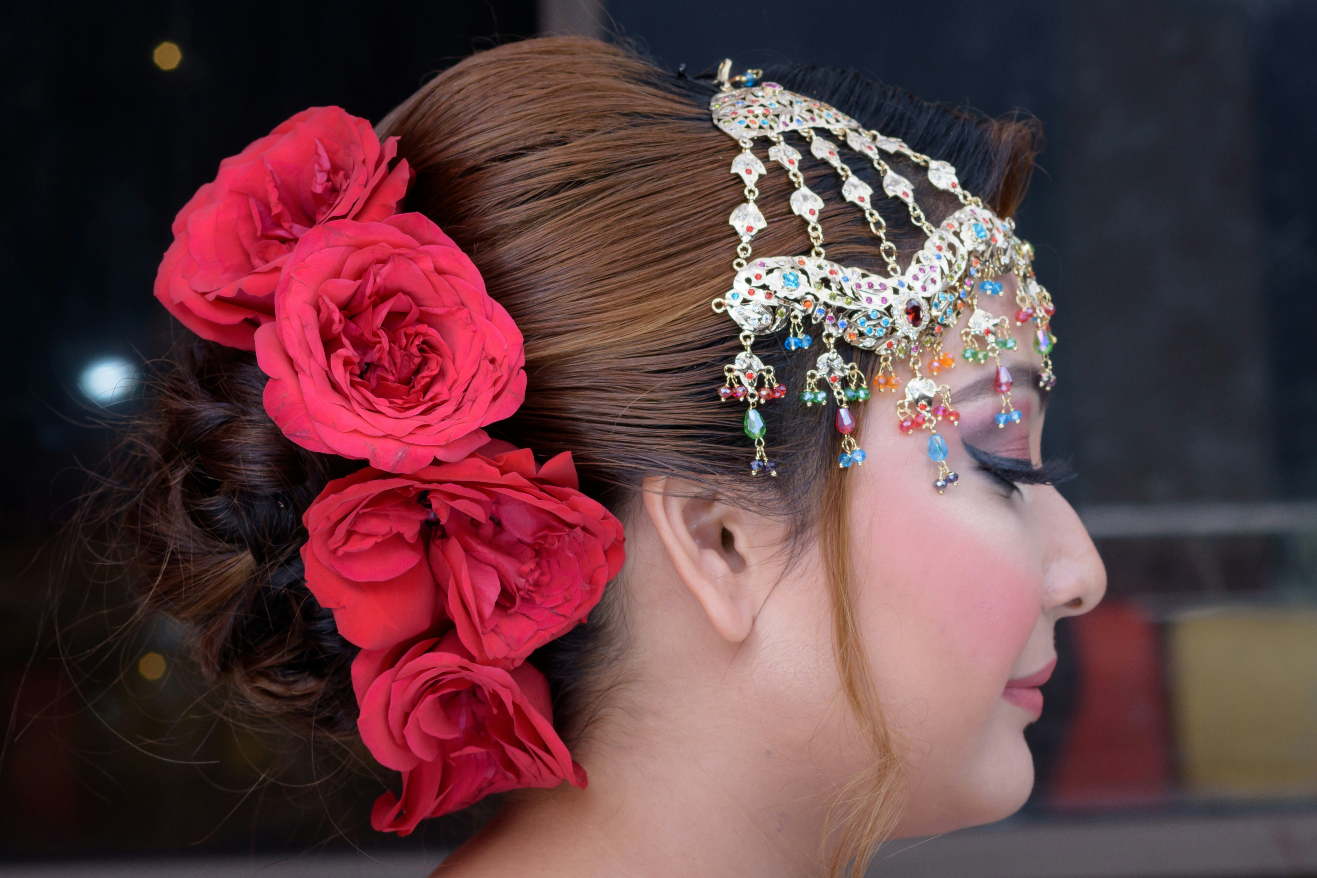 Crimson Petals Frame a Jeweled Halo: A Side-Profile Portrait