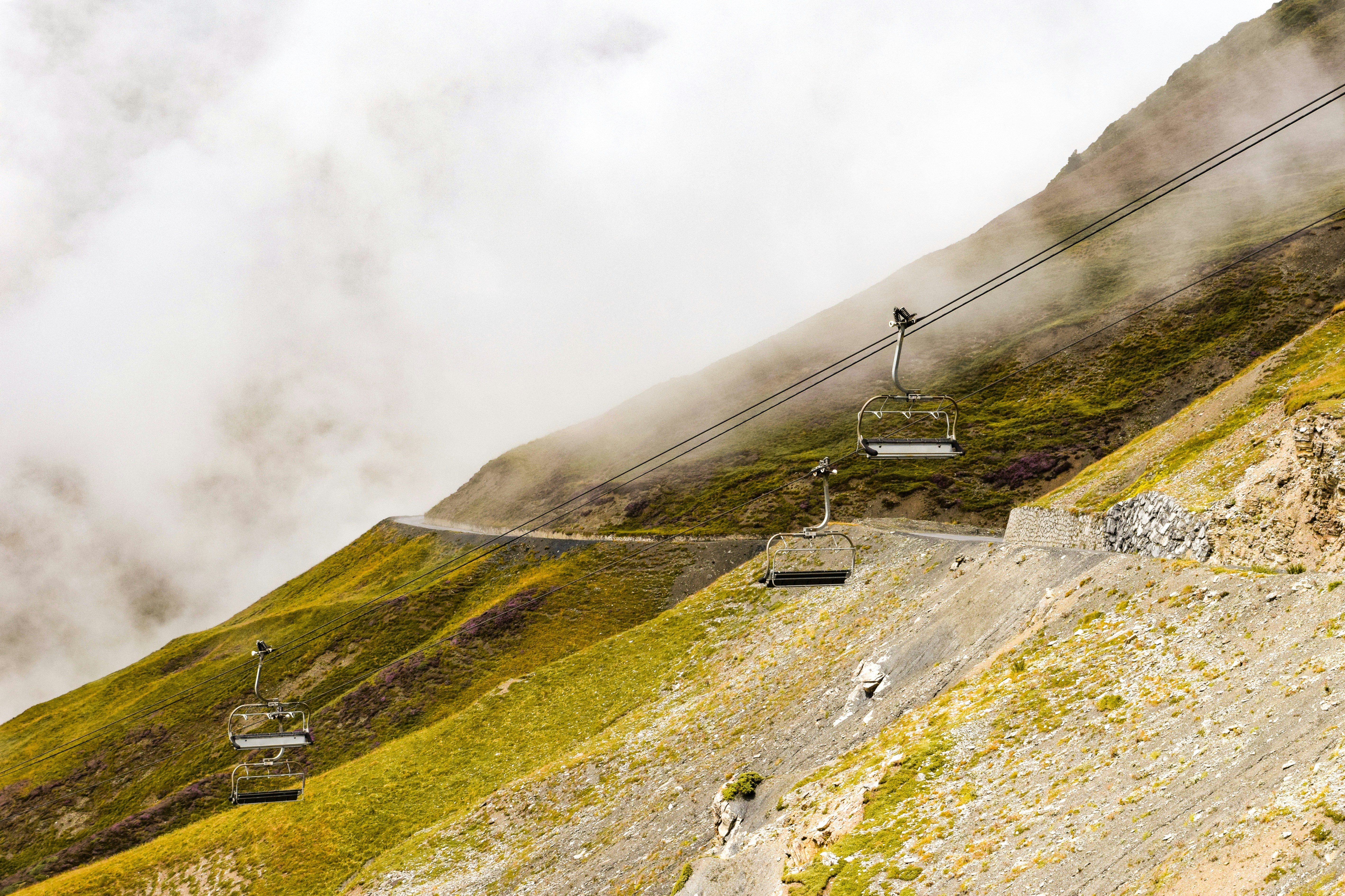 White cable car on green grass covered hill photo – Free Pyrénées Image ...
