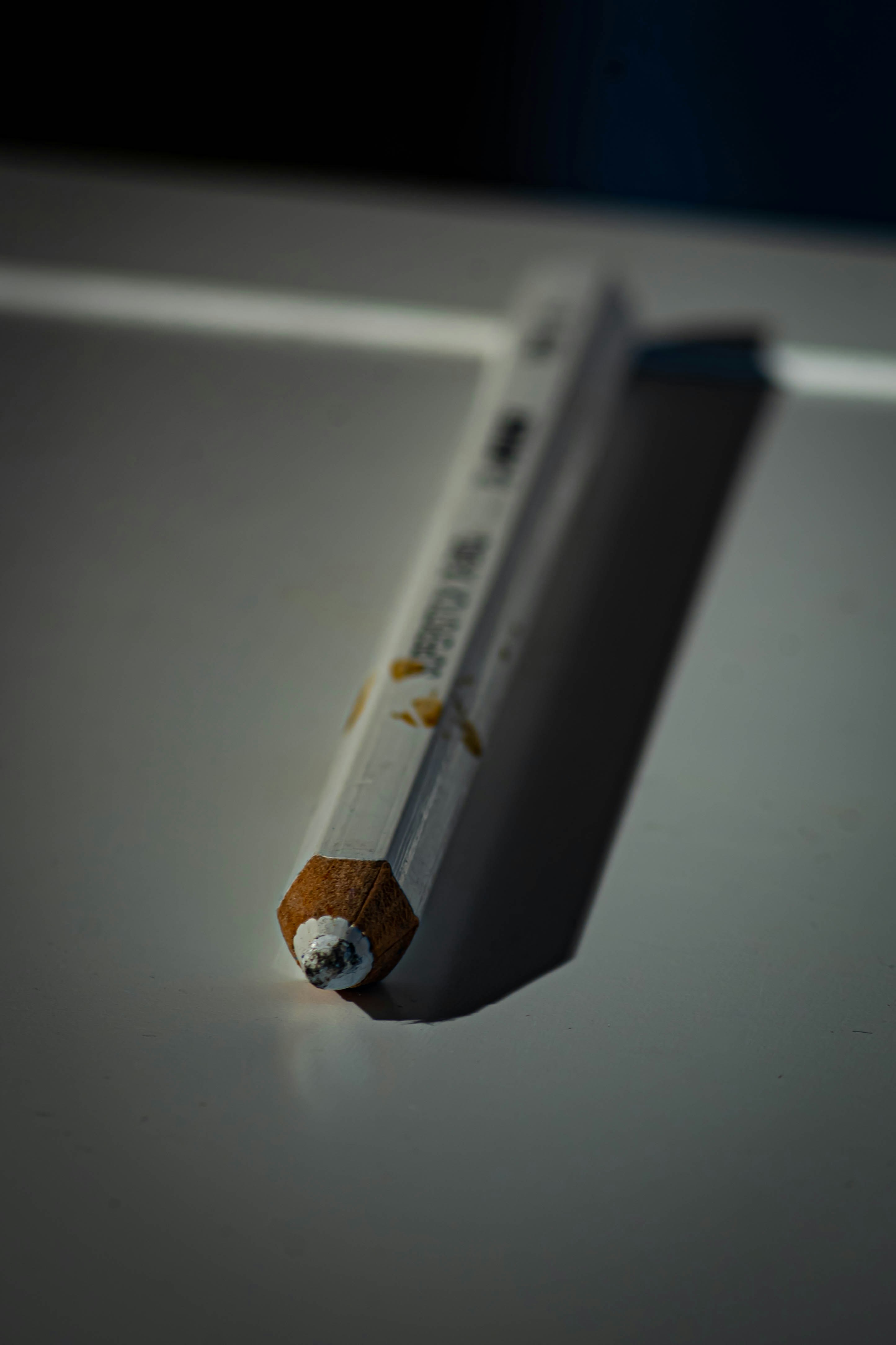 Lead in the Light: A Diagonal Pencil on a Quiet Desk