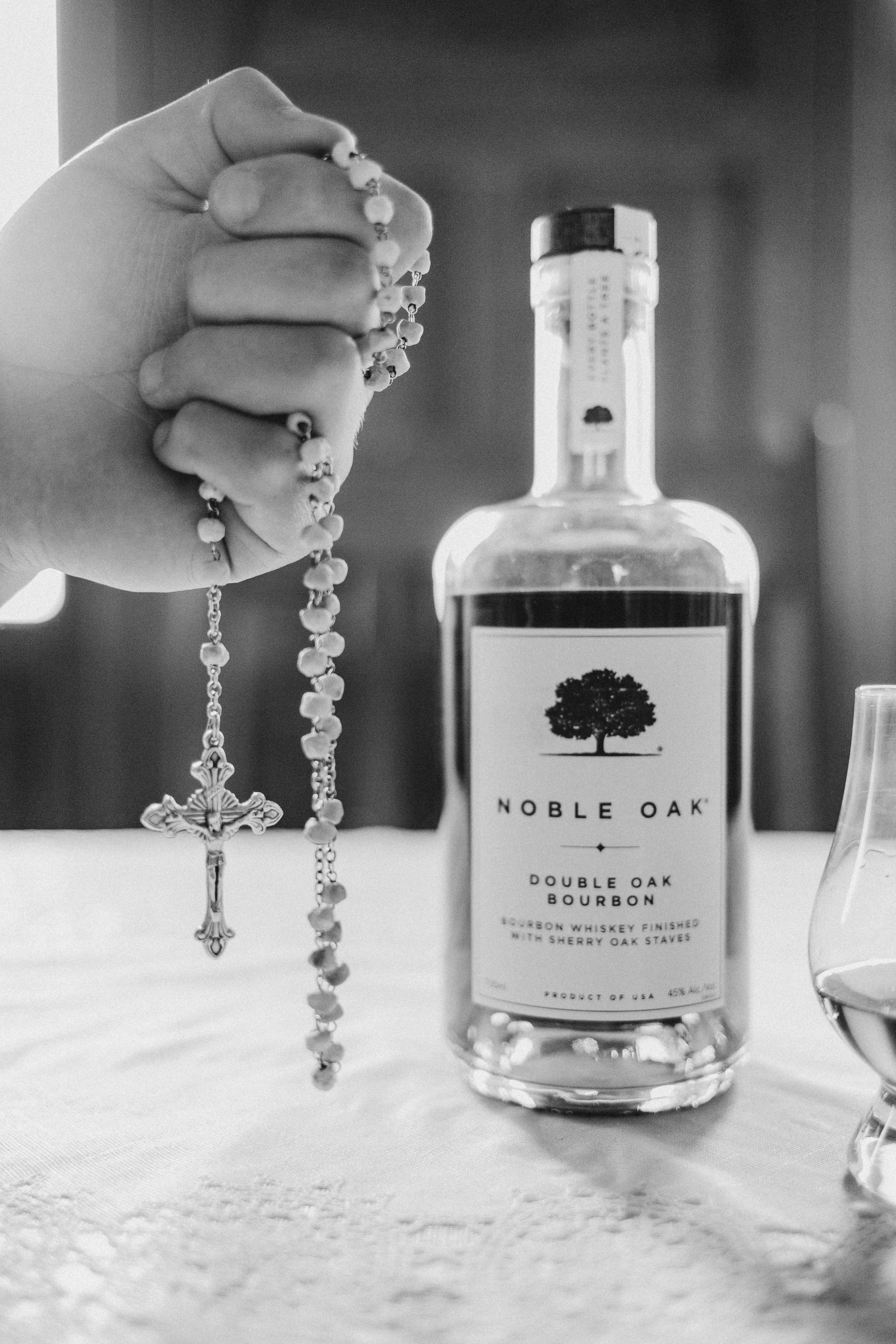 Beads, Hand, and Noble Oak: A Quiet Monochrome Still Life
