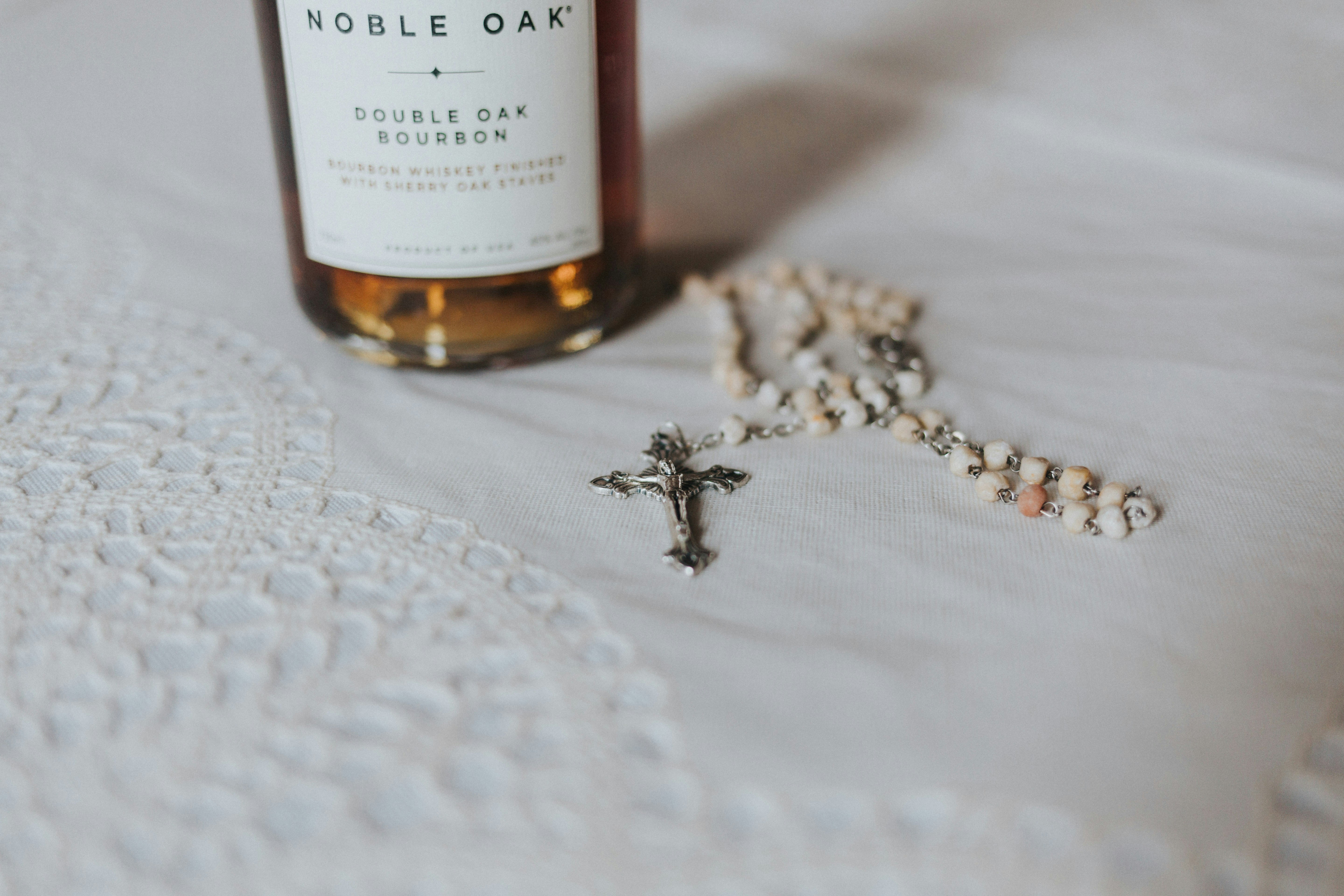 Beaded Prayer and Bourbon: A Quiet Still-Life Moment