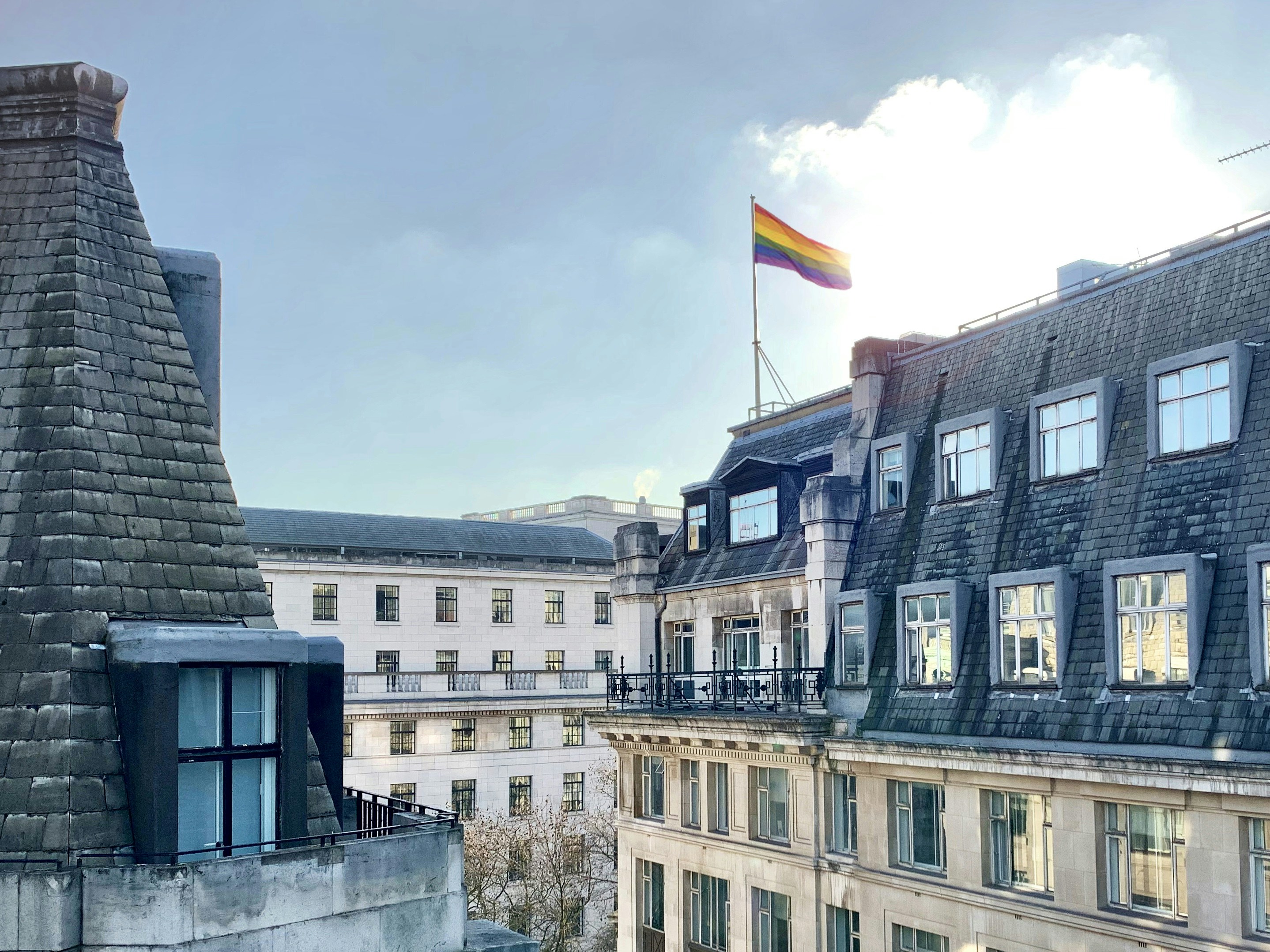 Rainbow Flag Above Edwardian Rooftops
