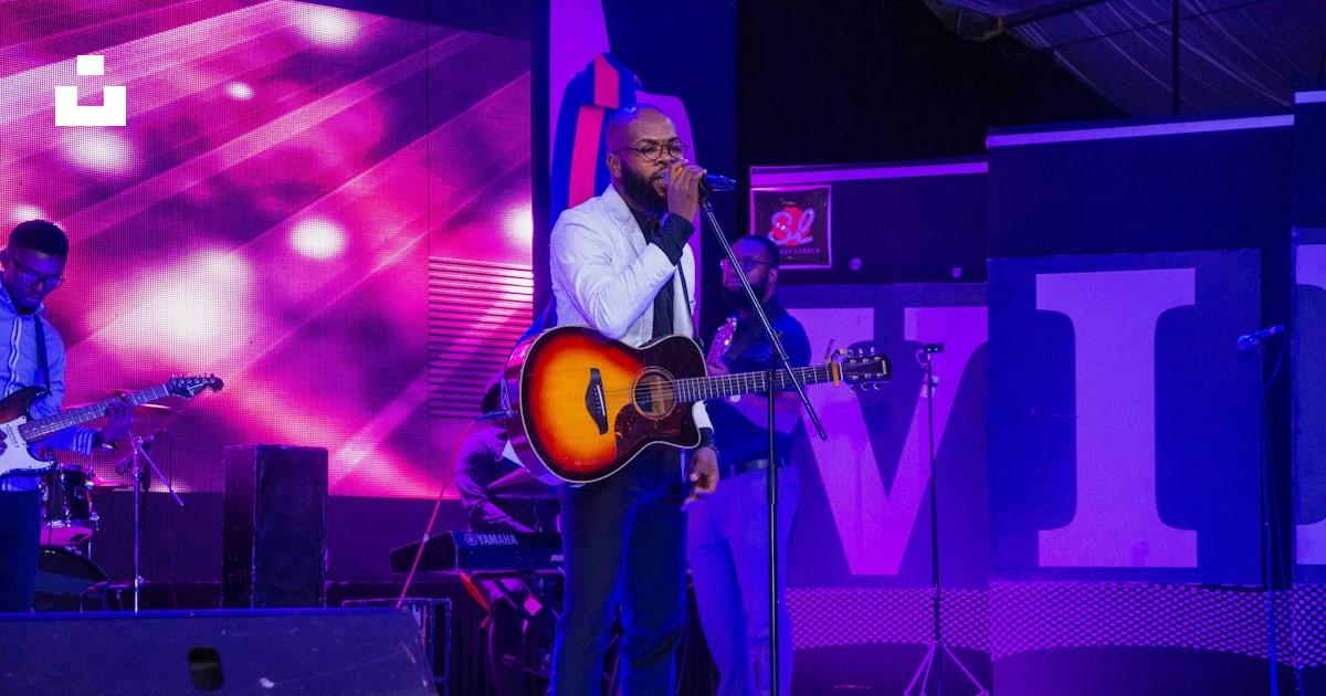 Man In White Dress Shirt Playing Guitar On Stage Photo Free Leisure