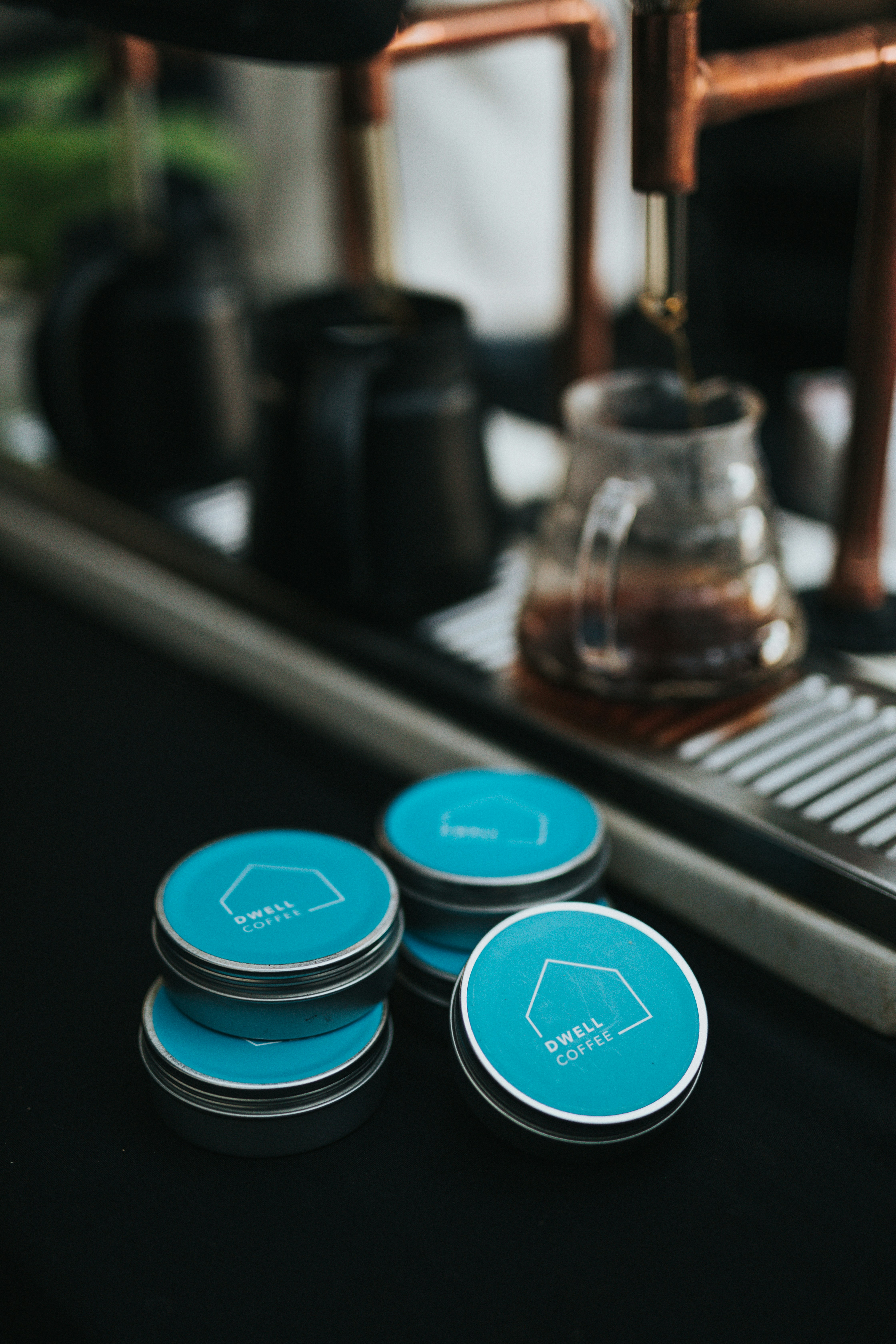 Dwelling in Blue: A Quiet Stack of Coffee Tins on a Studio Counter