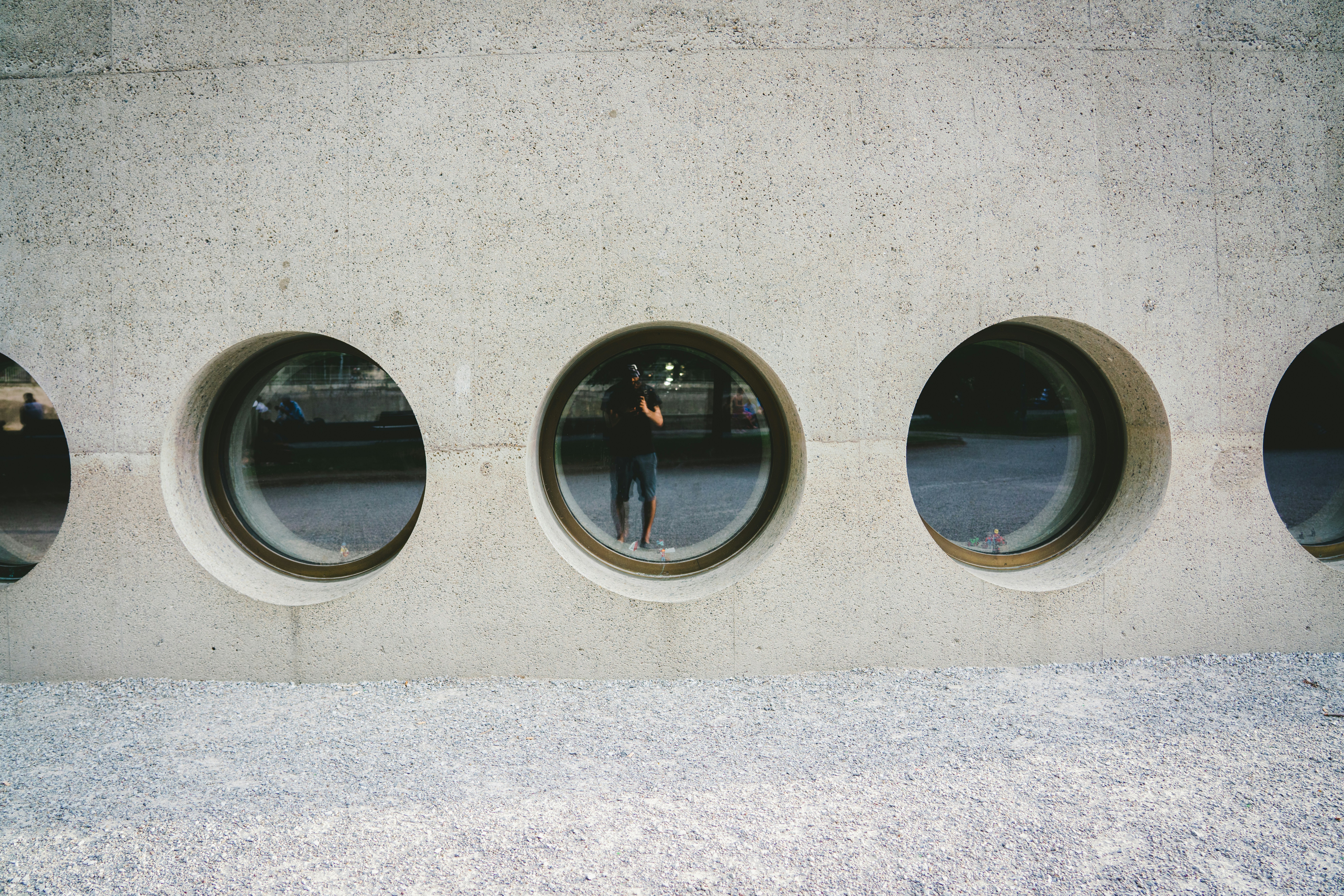 Circular Windows, Quiet Reflections: Urban Concrete Portraits