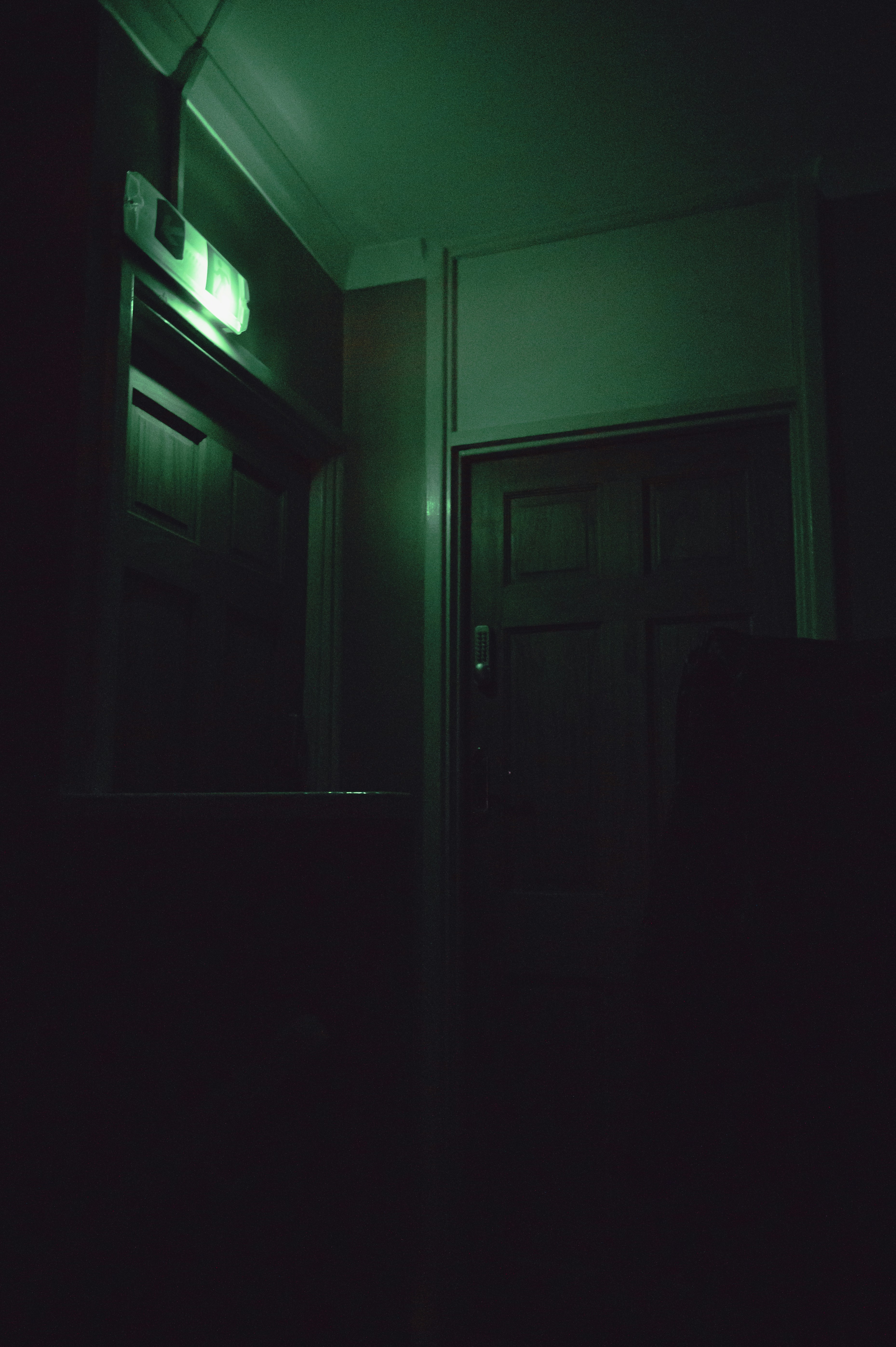 green wooden door with glass panelAlexandre Debiève