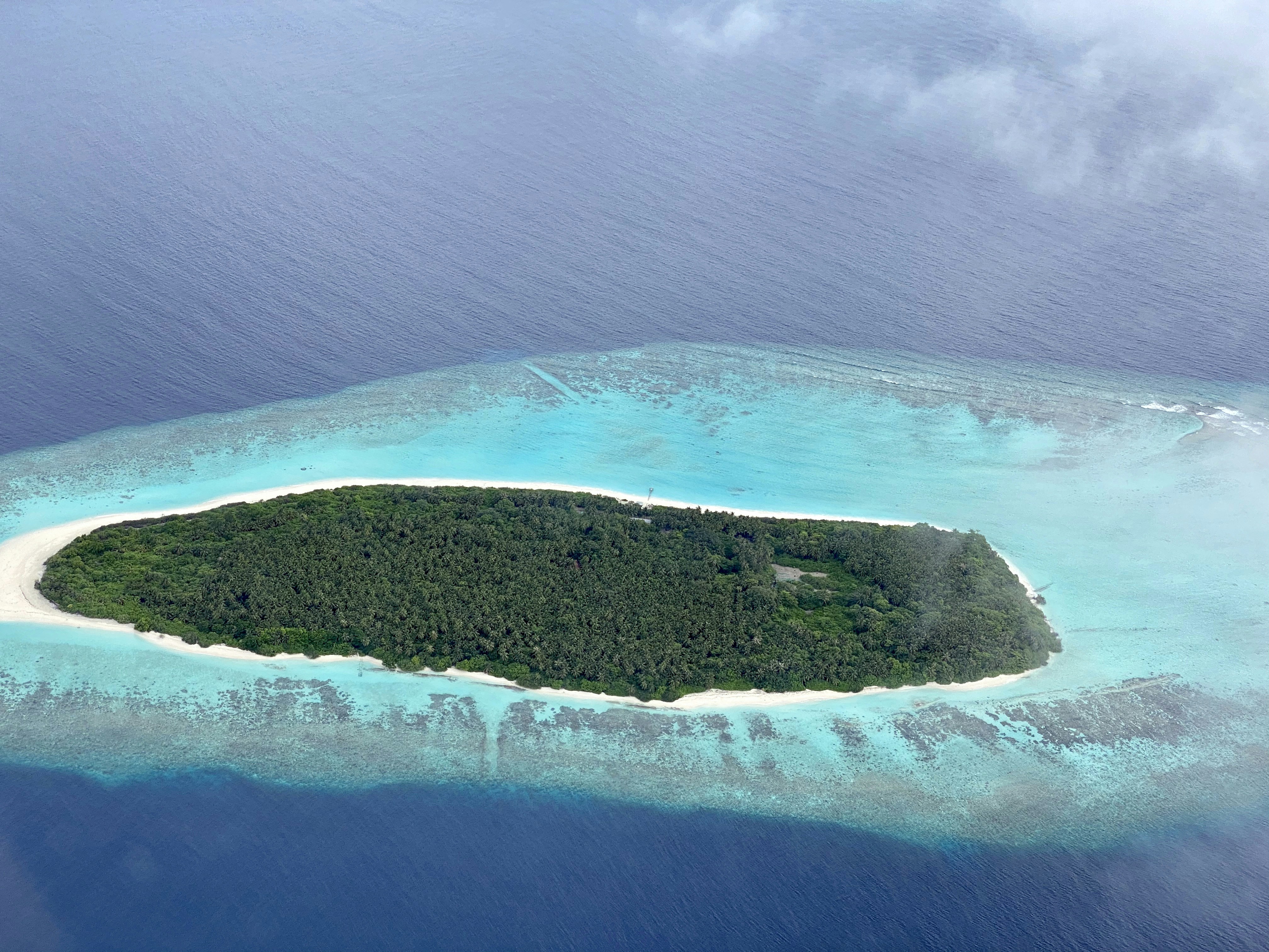 Brown and gray rock formation on body of water photo – Free Maldives ...
