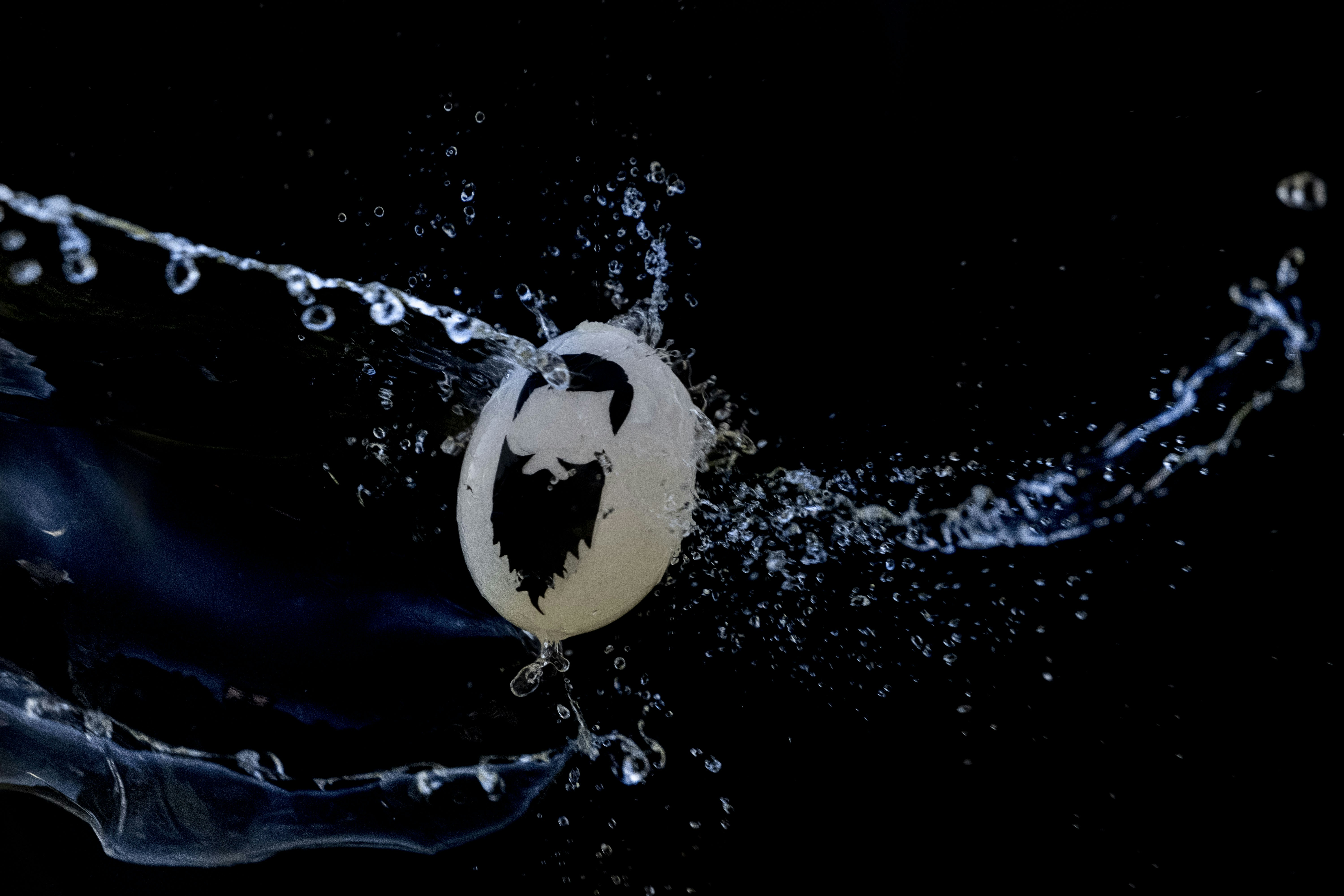 a black and white photo of a water drop