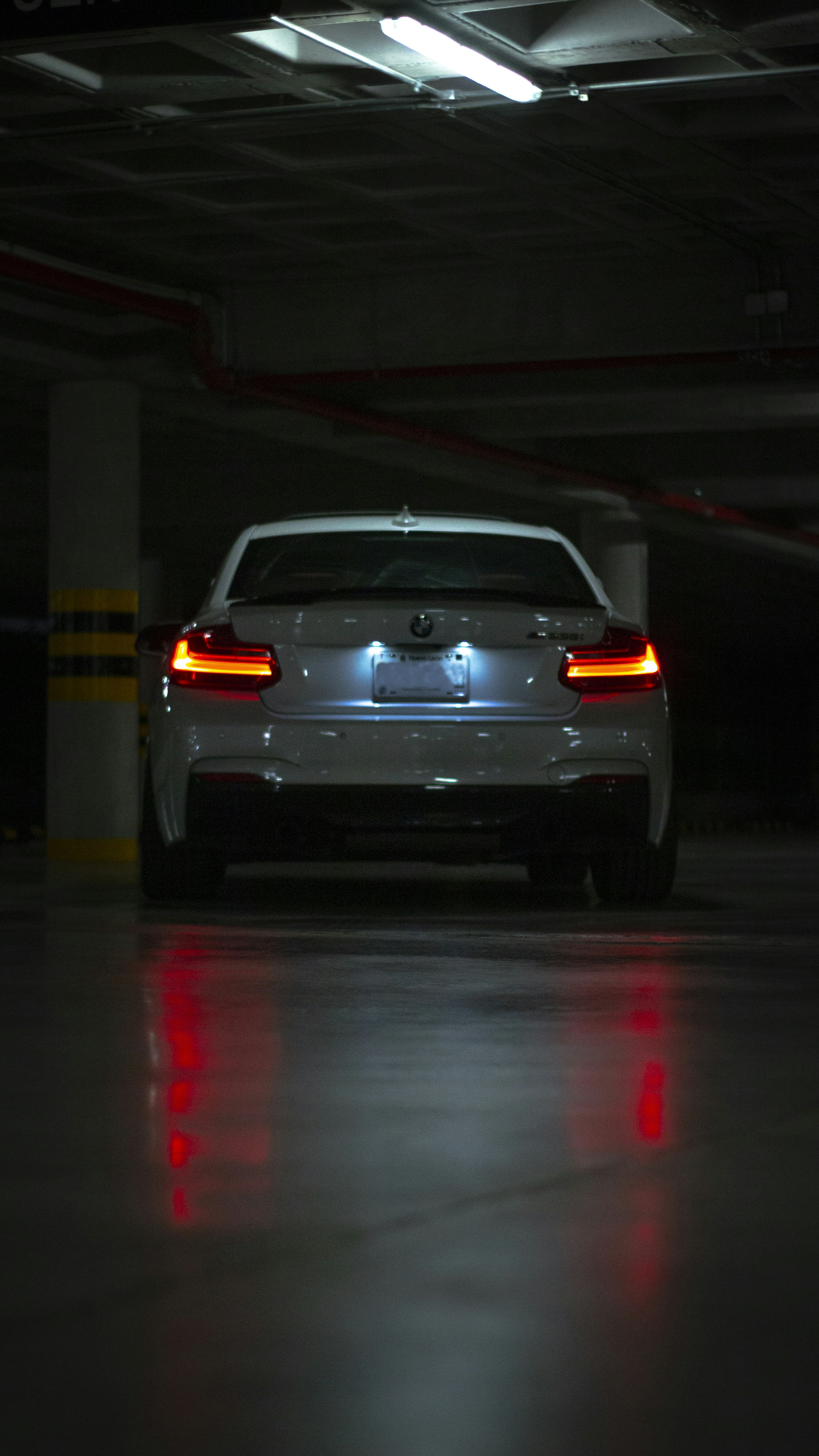 white car on road during night time
