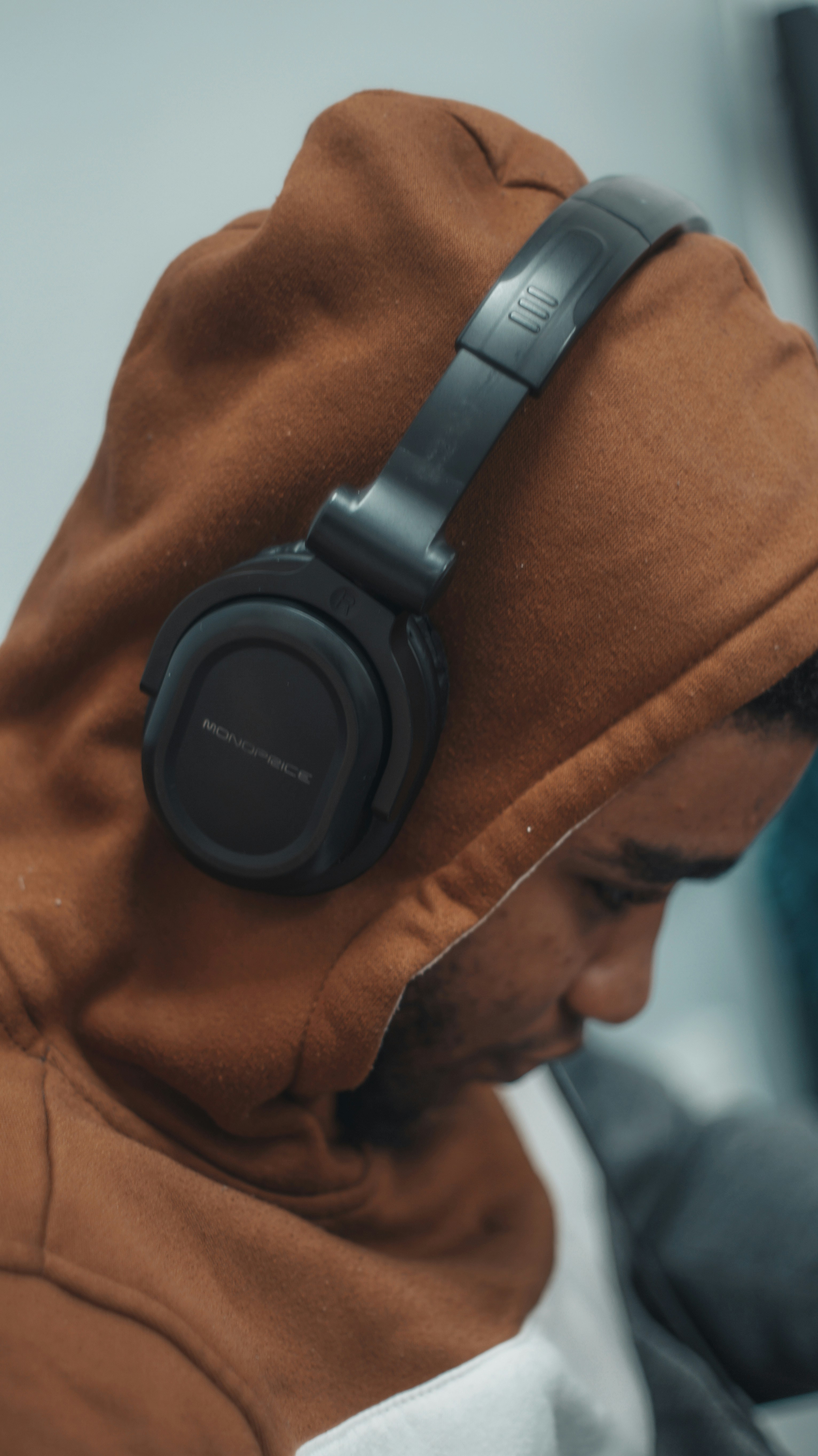 Hoodie-Hued Focus: A Quiet Moment with MONSTER Headphones
