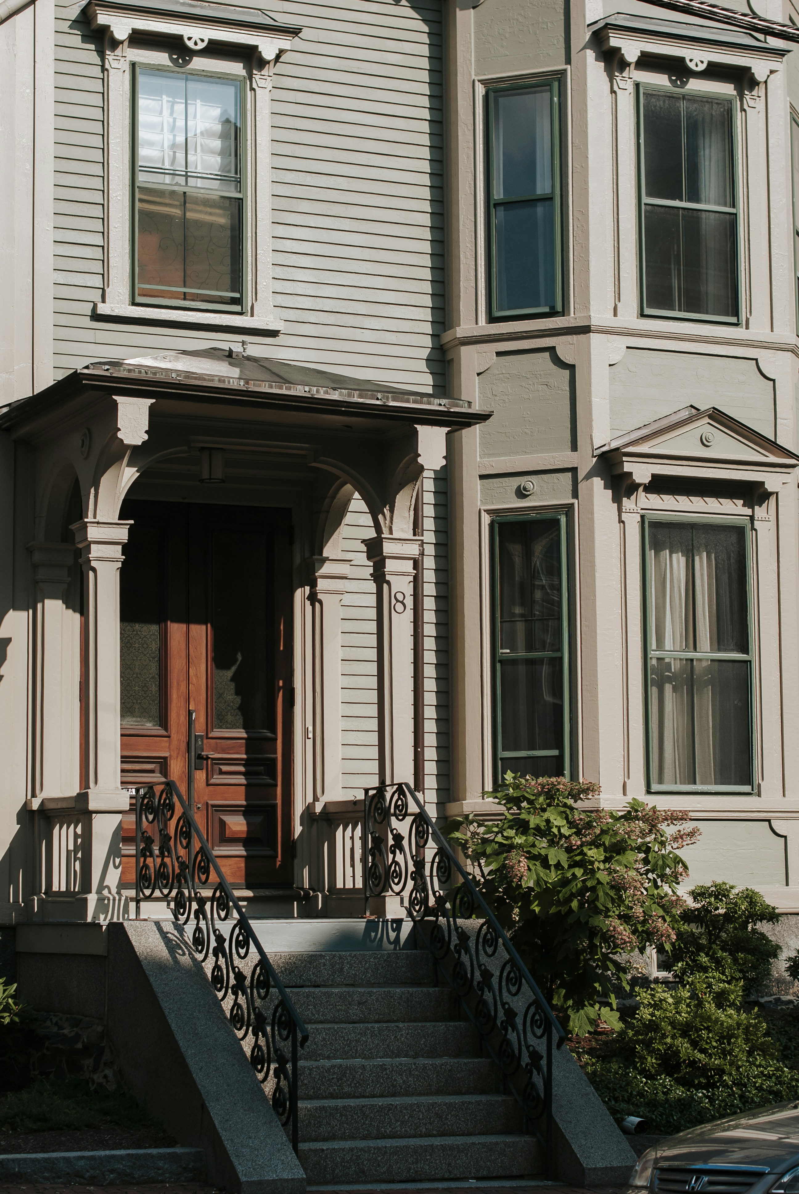 Black metal railings near white wooden framed glass window photo – Free ...