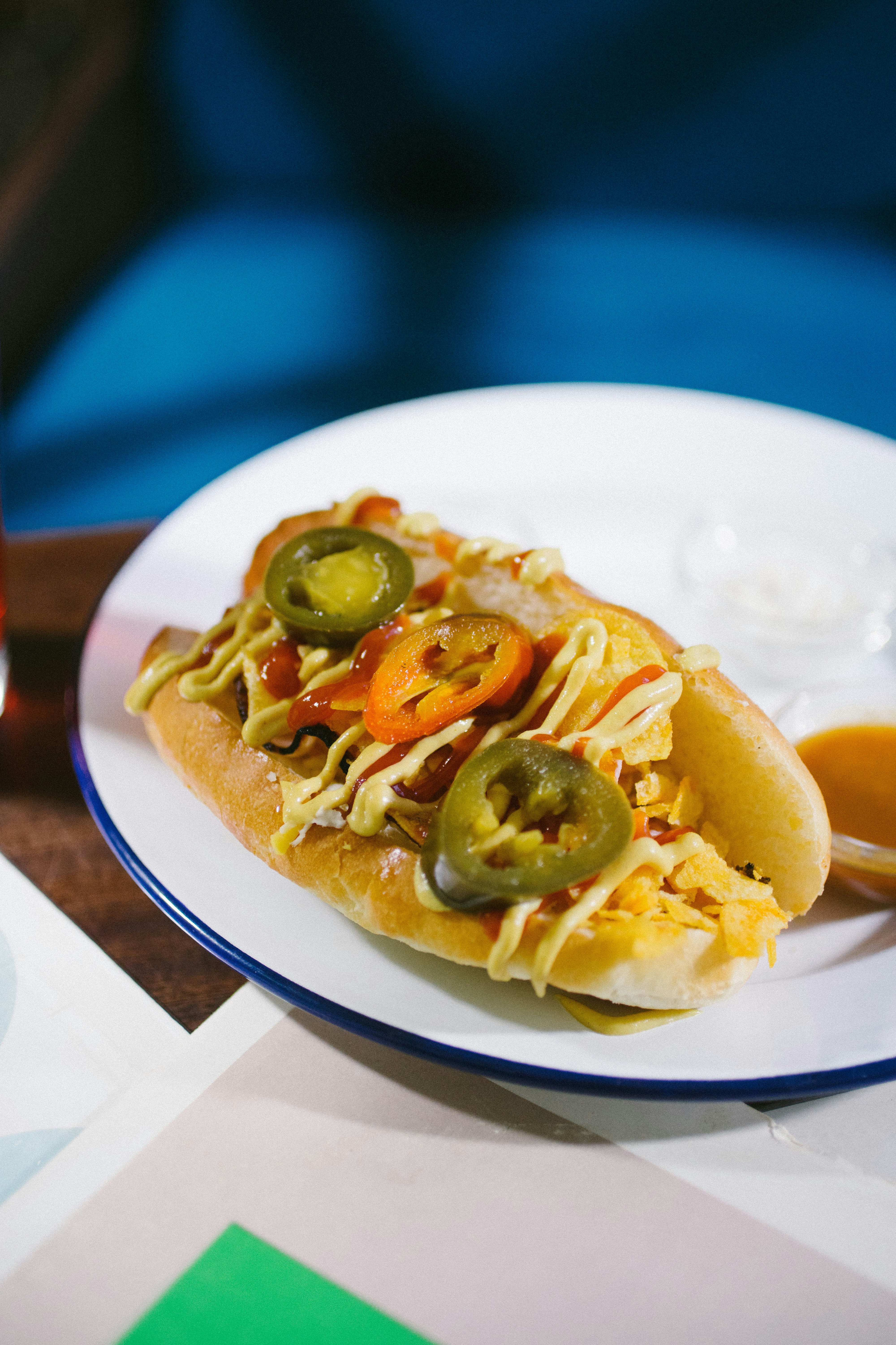 Street Taco Dream: A Loaded Hot Dog Embraced by Jalapeño and Sunny Toppings