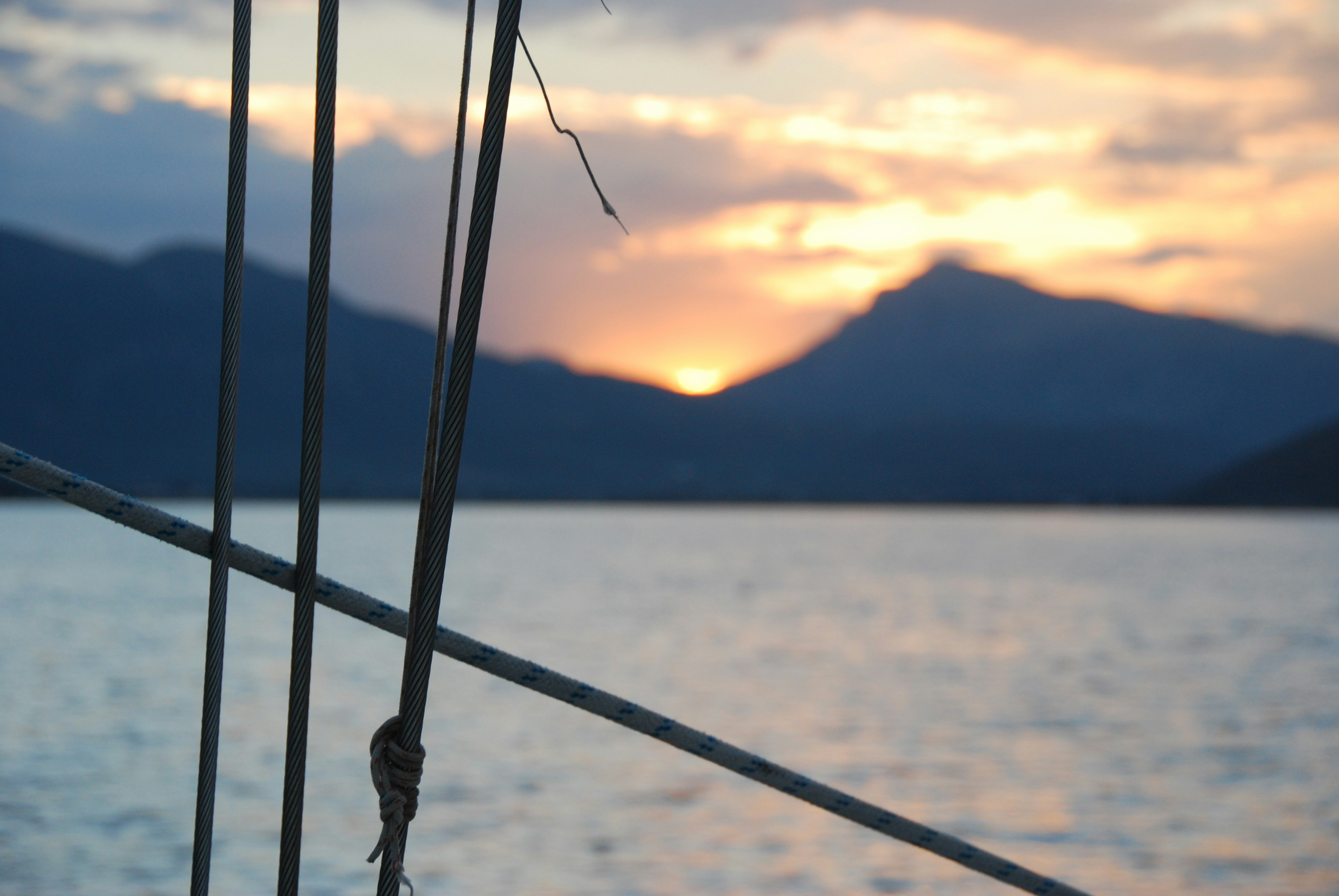 Tethered Horizon: Framing a Quiet Sunset Over Calm Waters