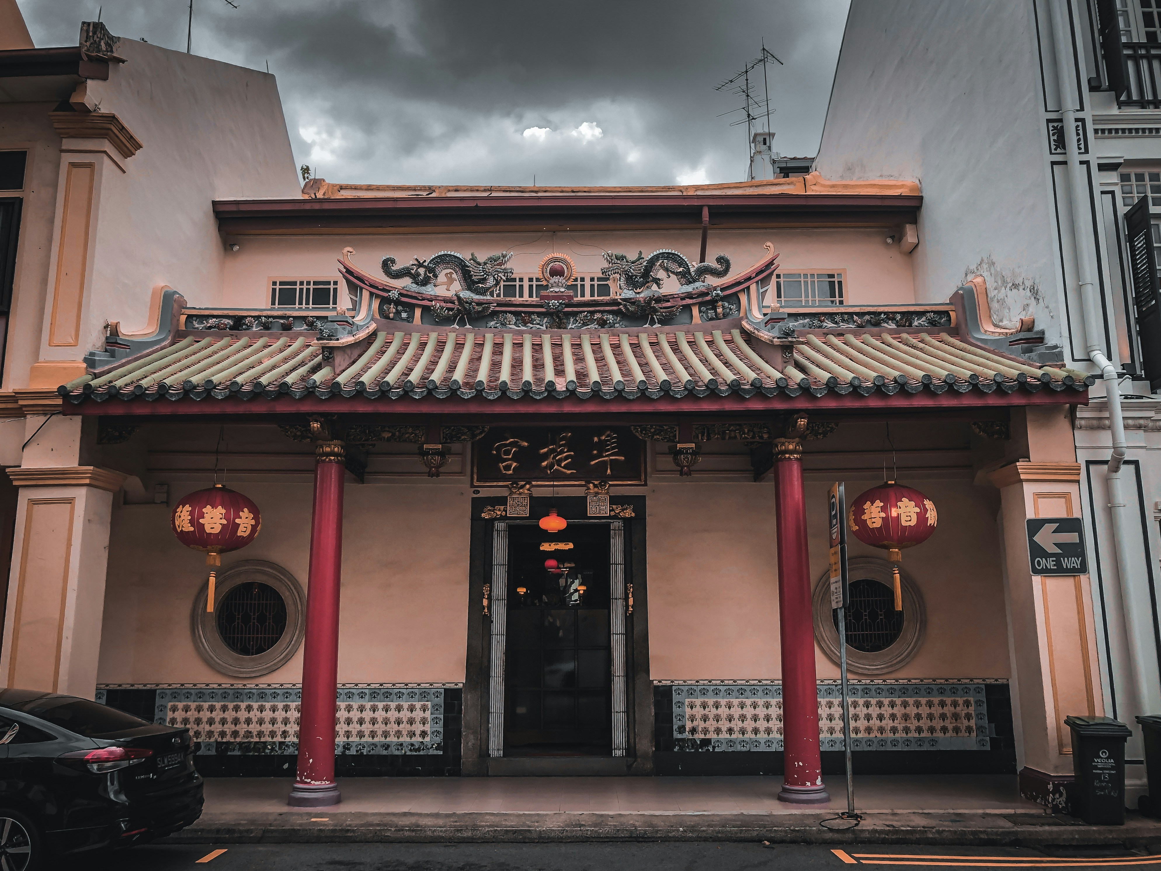 Lanterns and Rooflines: a Temple Gate under Stormy Skies