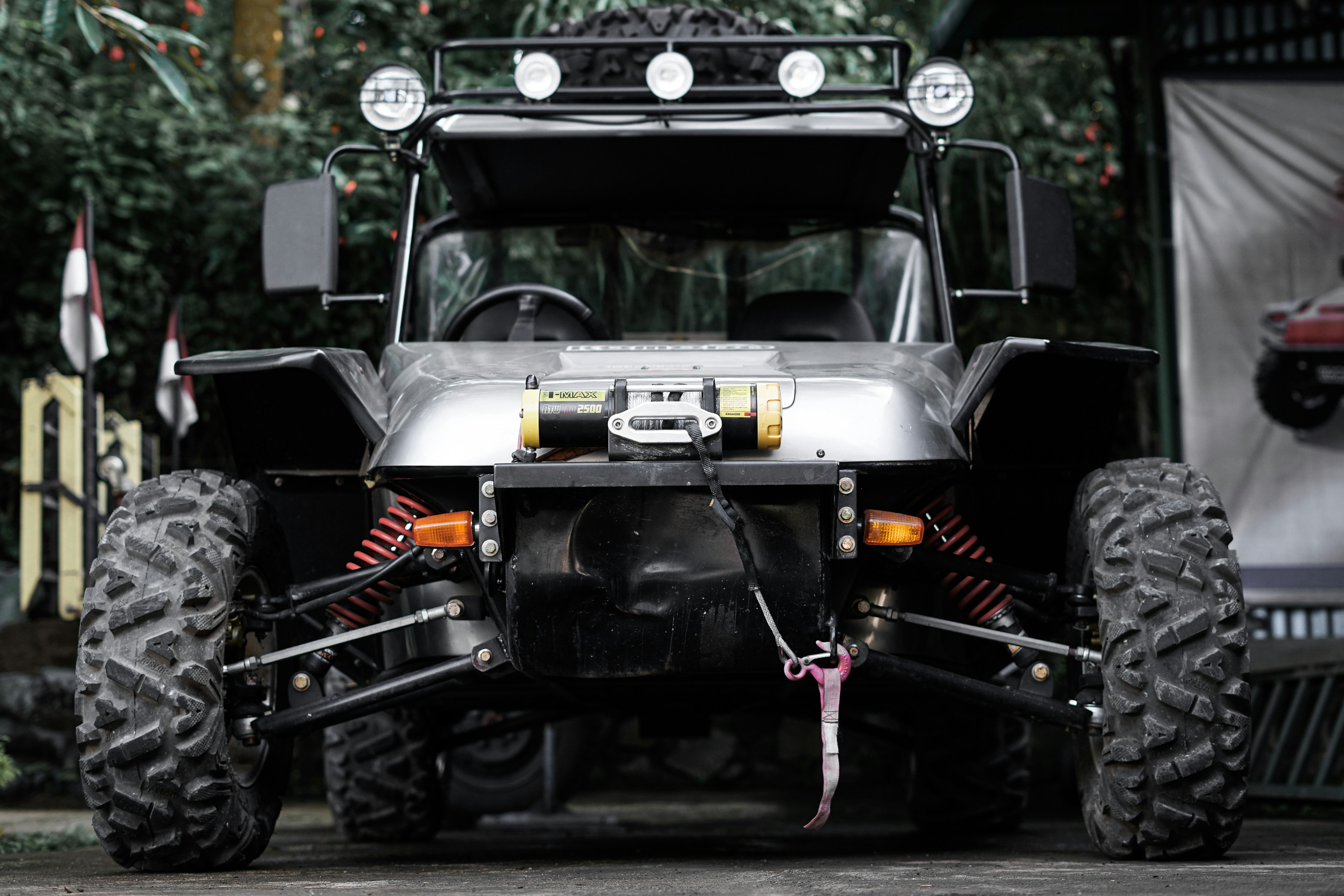 Front view of a robust all-terrain vehicle showcasing its powerful build and off-road capabilities.