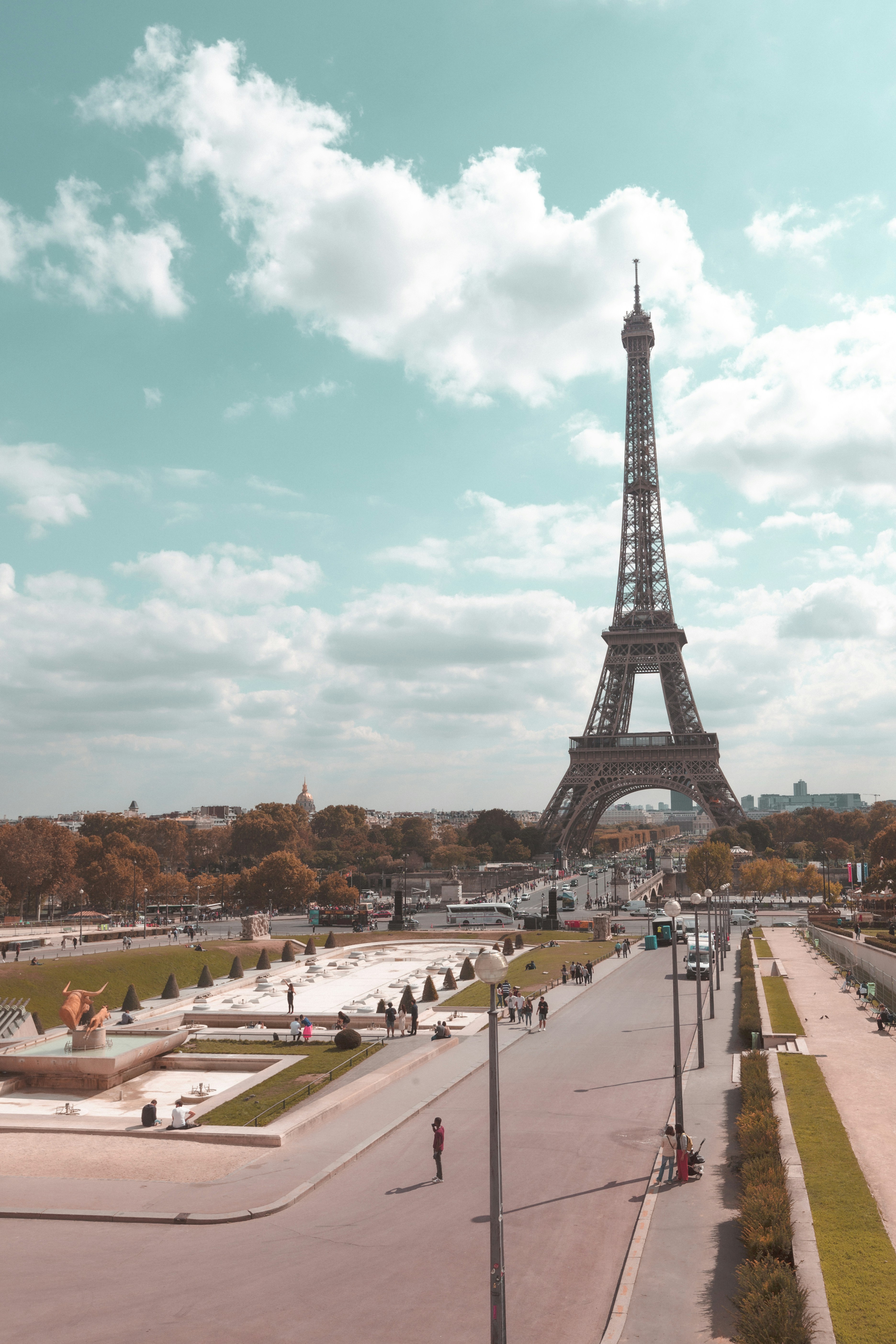 people walking on street near eiffel tower during daytime