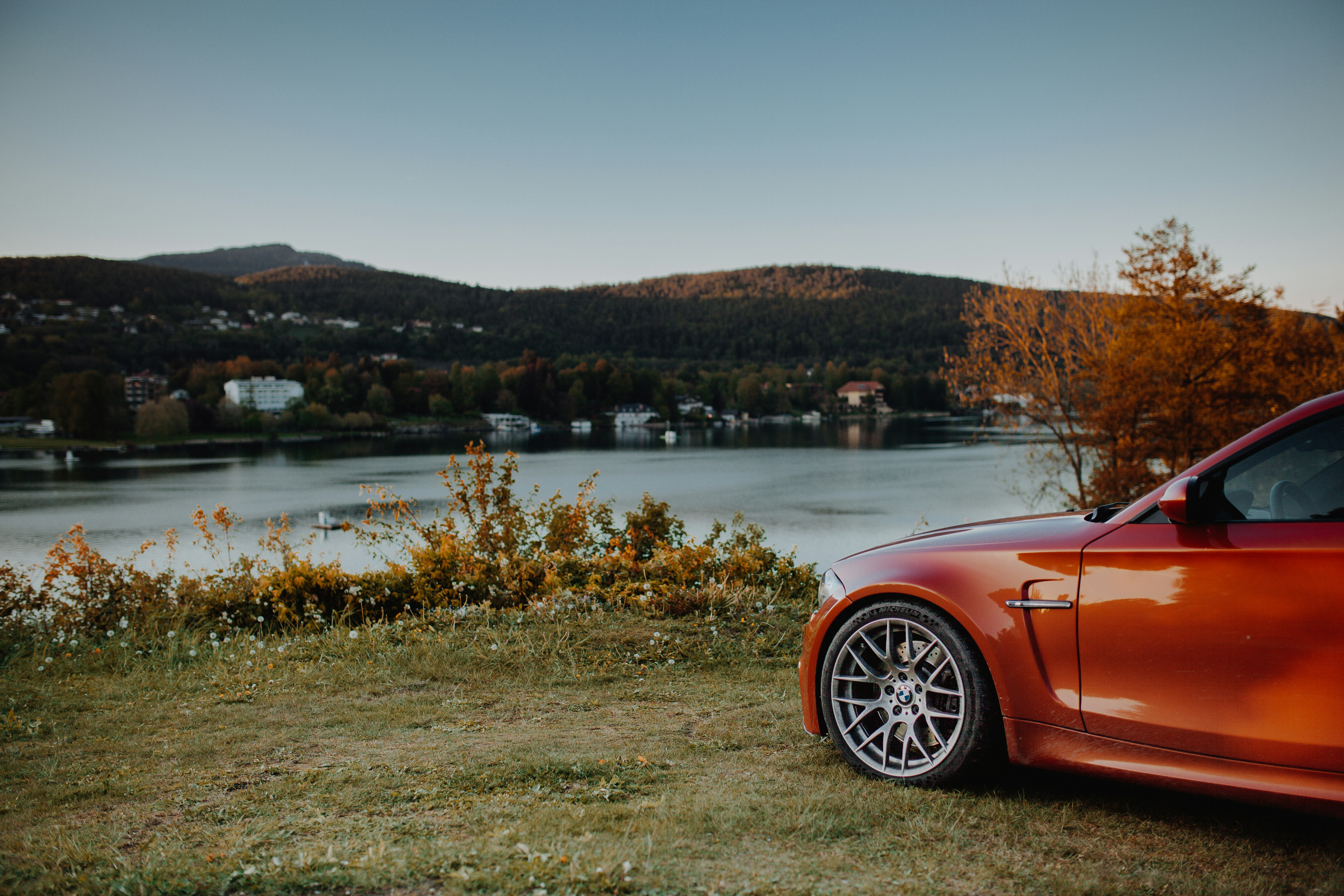 Rusted Sunset Drive: A Chrome Accent by the Lake Edge