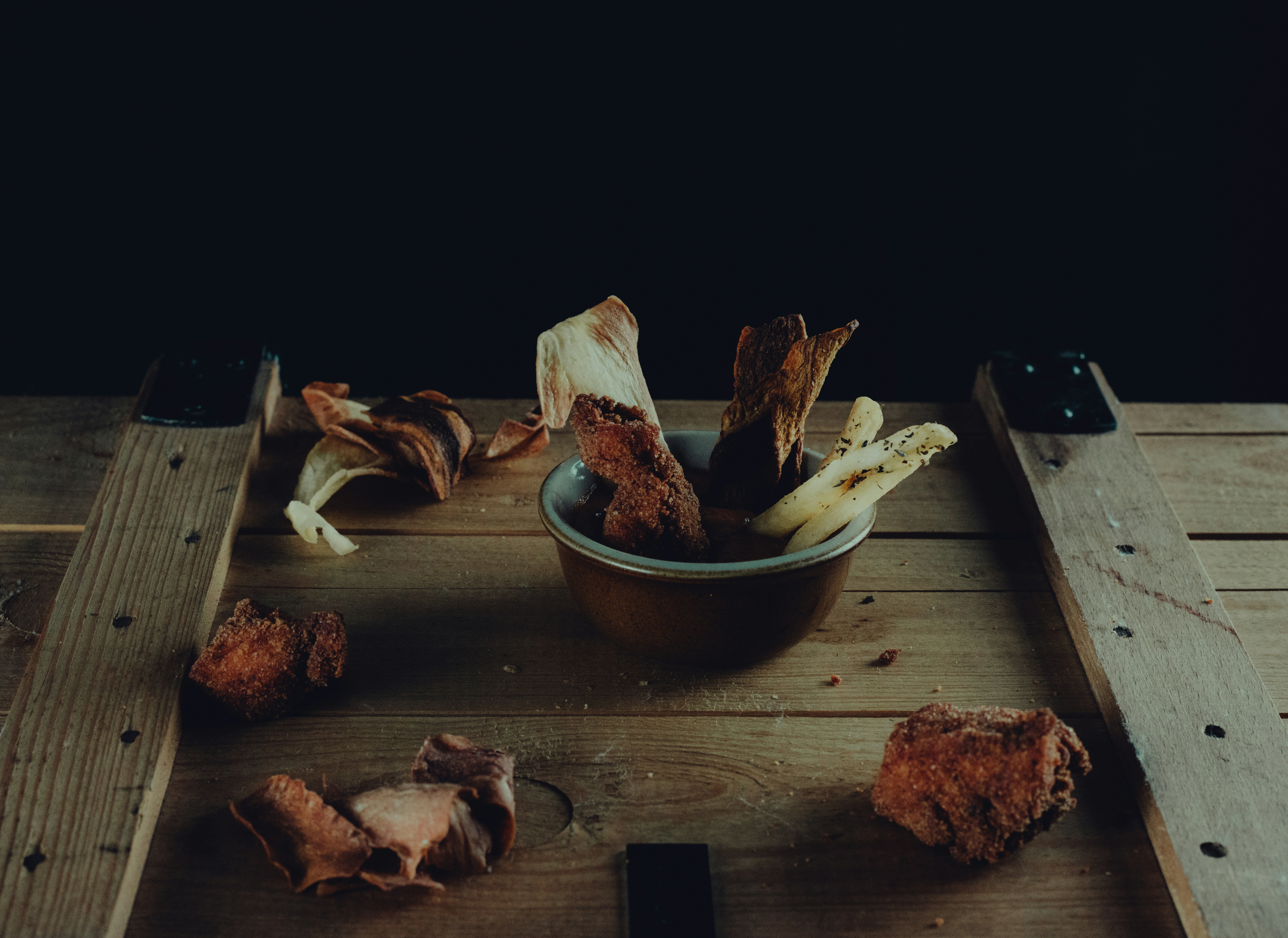 Sauce with meat and french fries on wood