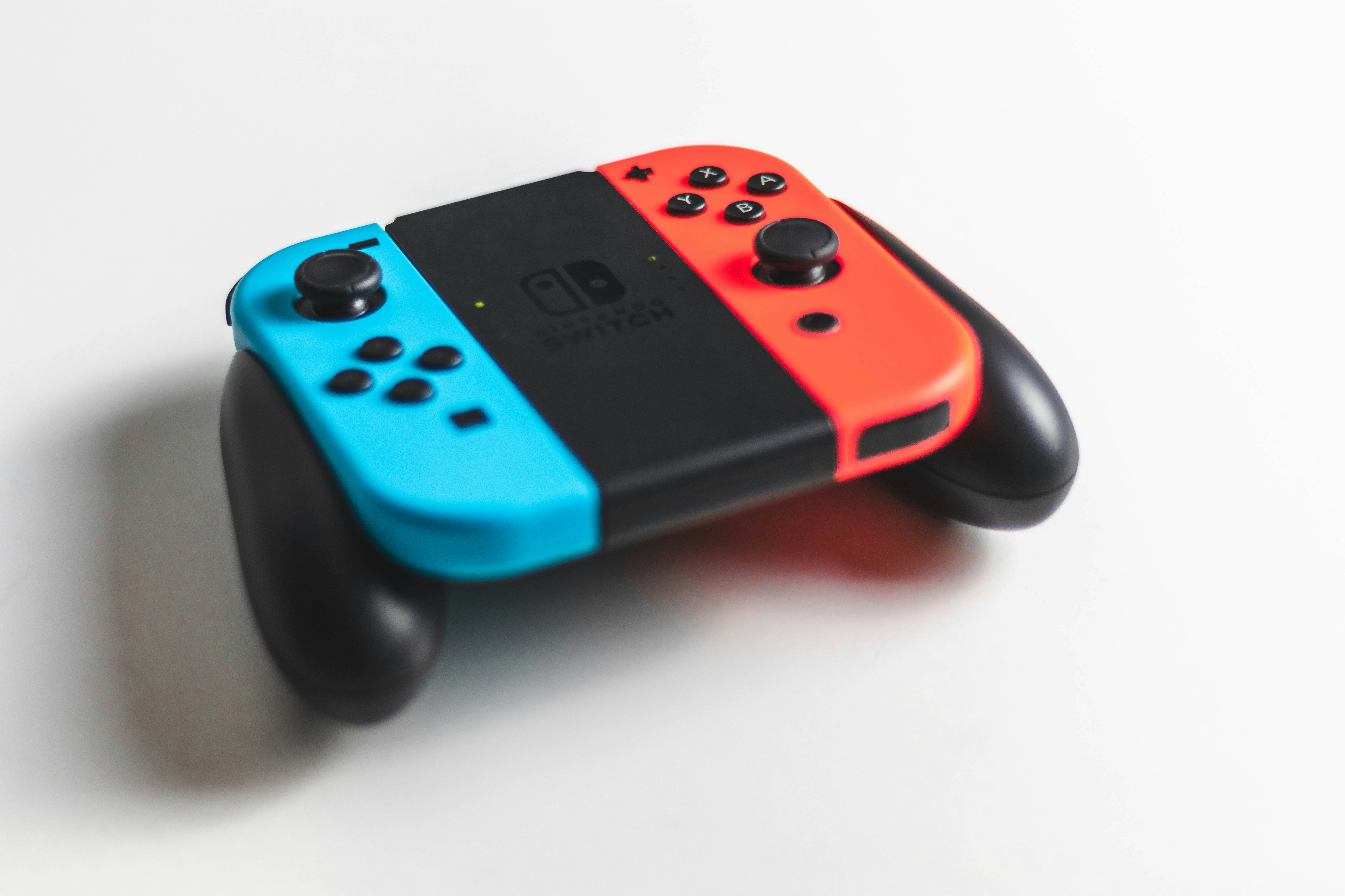 Orange and black game controller photo – Free Nintendo switch ...