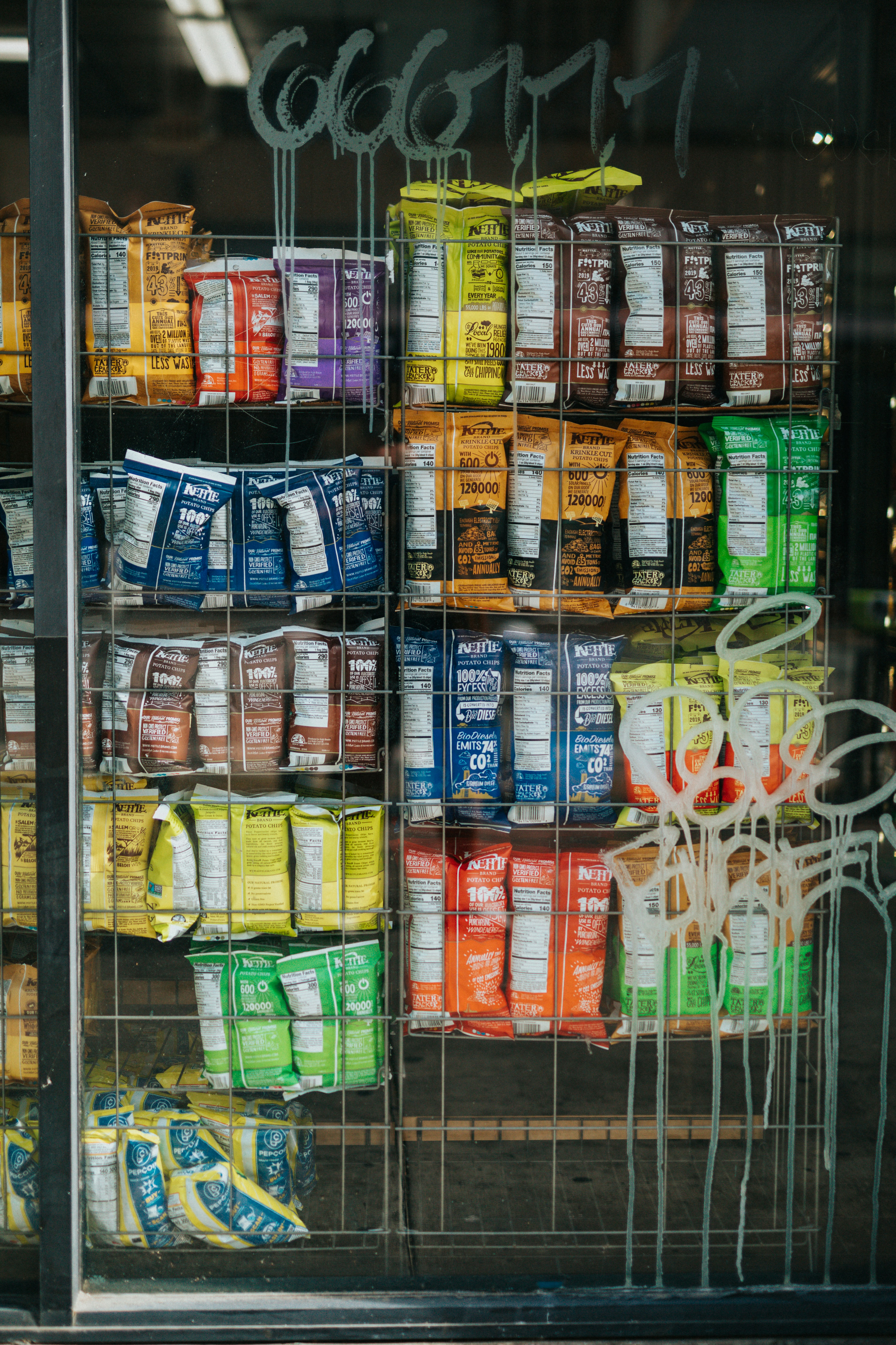 Window of Color: A Market Shelf Symphony Through Graffiti Glass