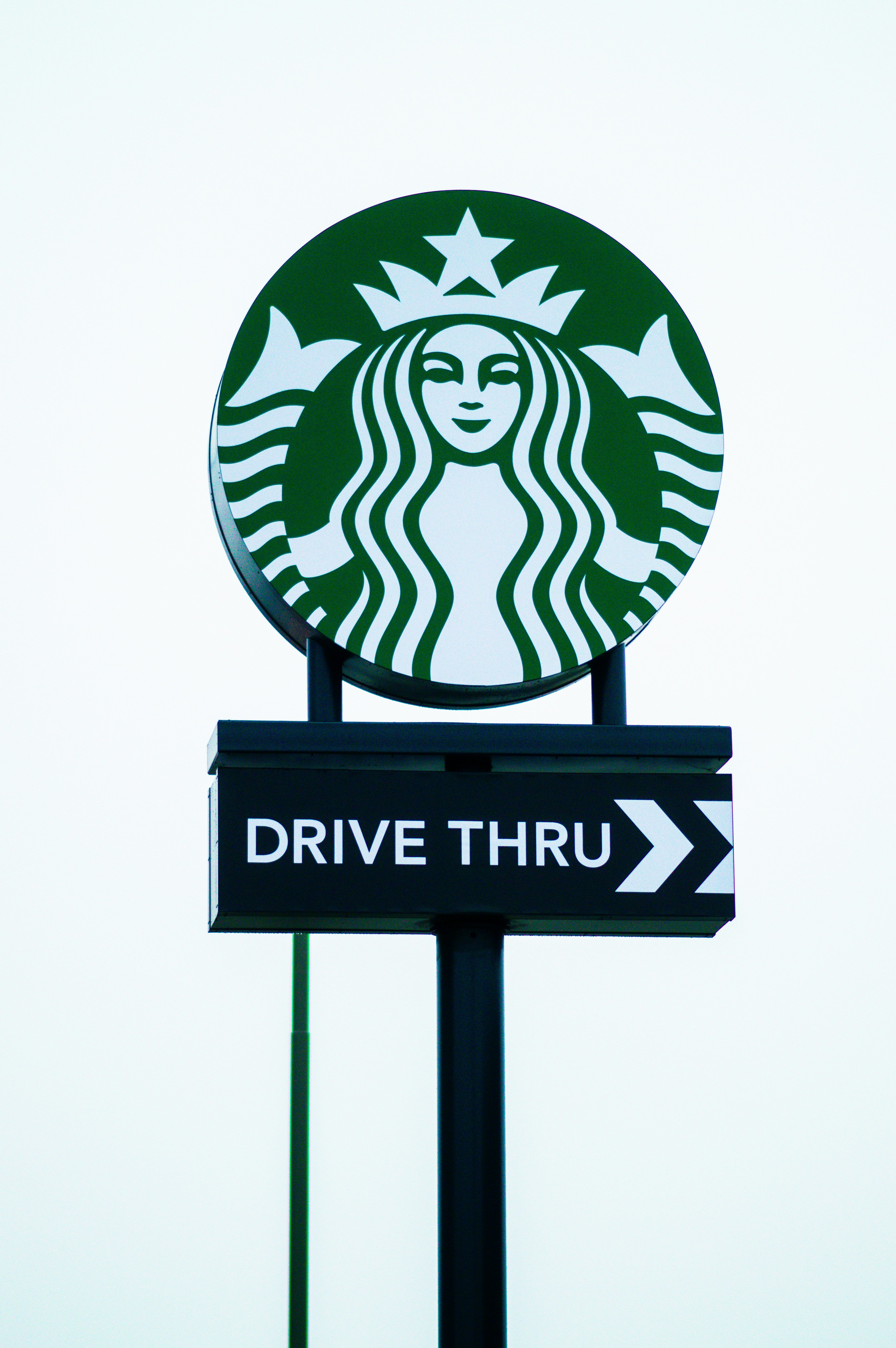 white and green round sign