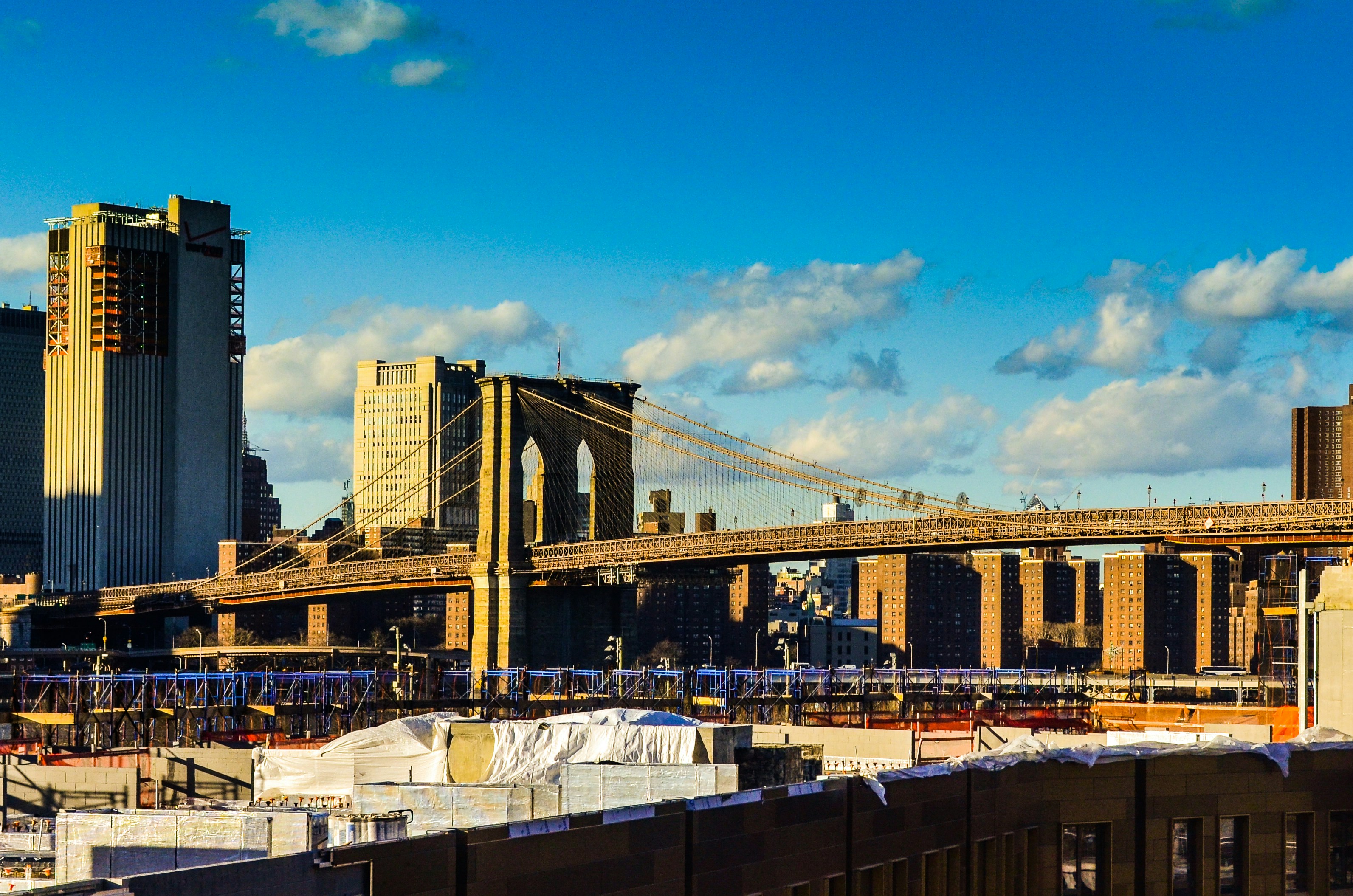 Brooklyn Bridge Chronicle: Steel Arches Framing a Construction-Front Skyline