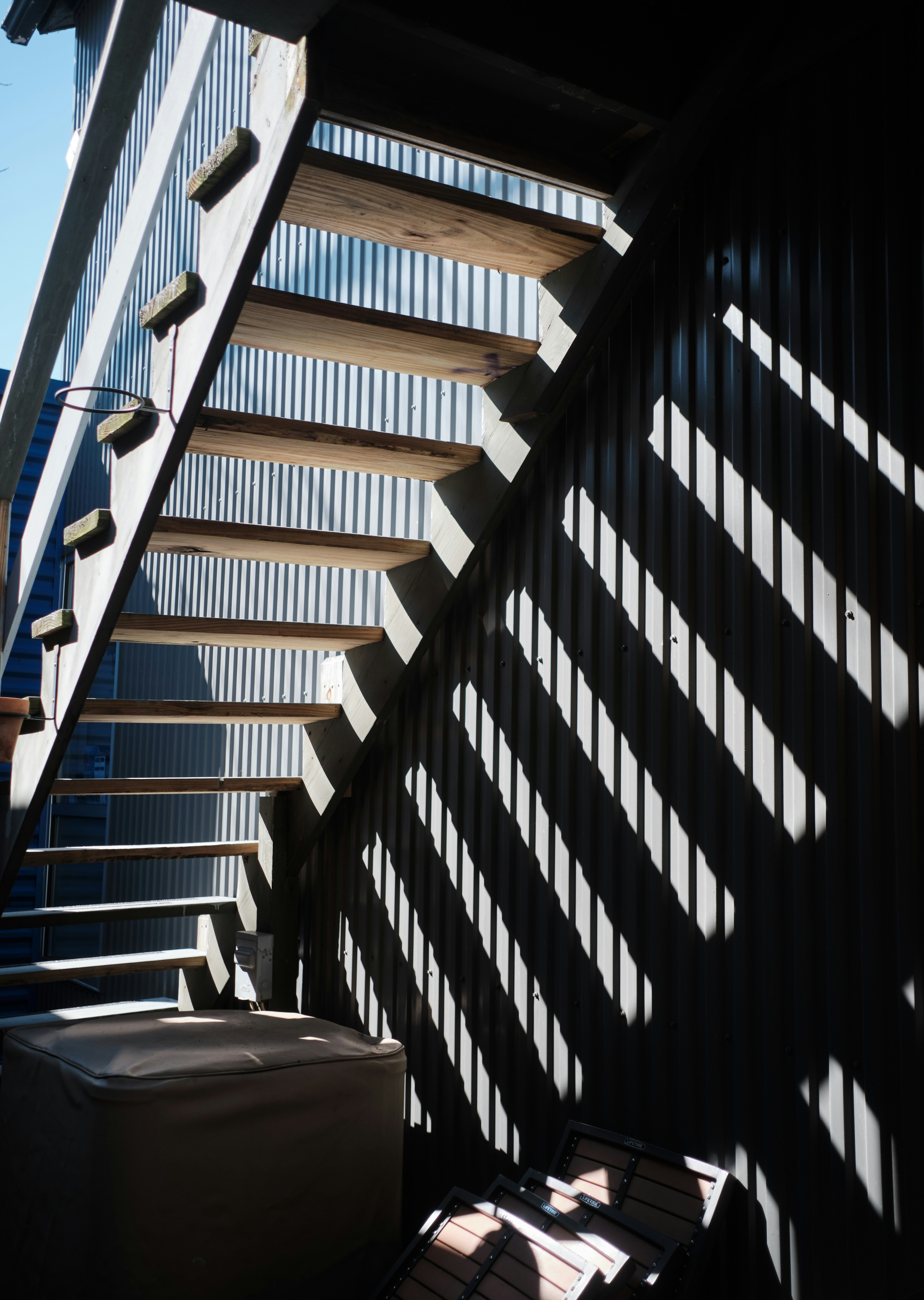 White car in front of white and black concrete building photo – Free ...