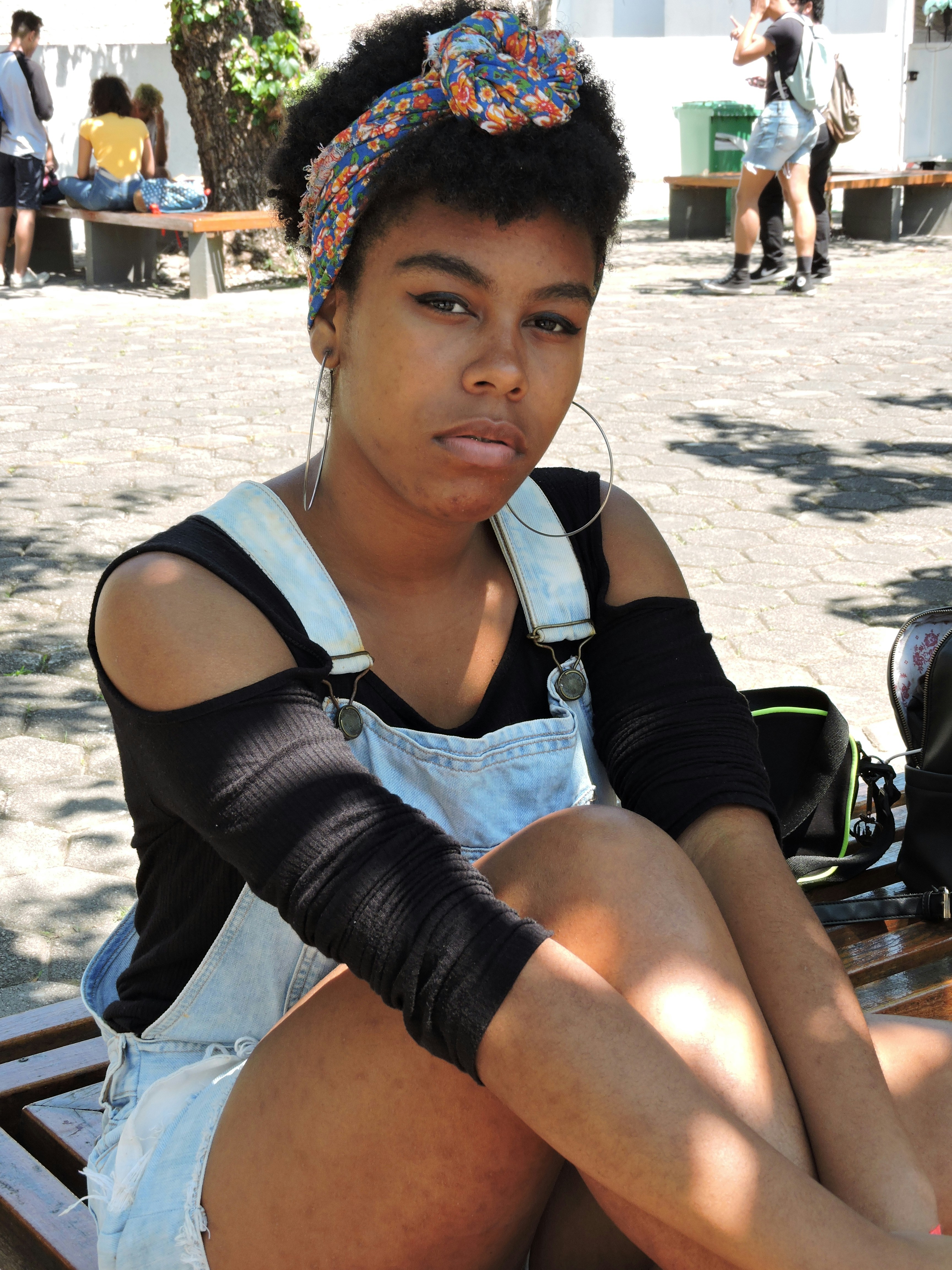 Portrait on a Sunlit Plaza: The Quiet Confidence of a Youth