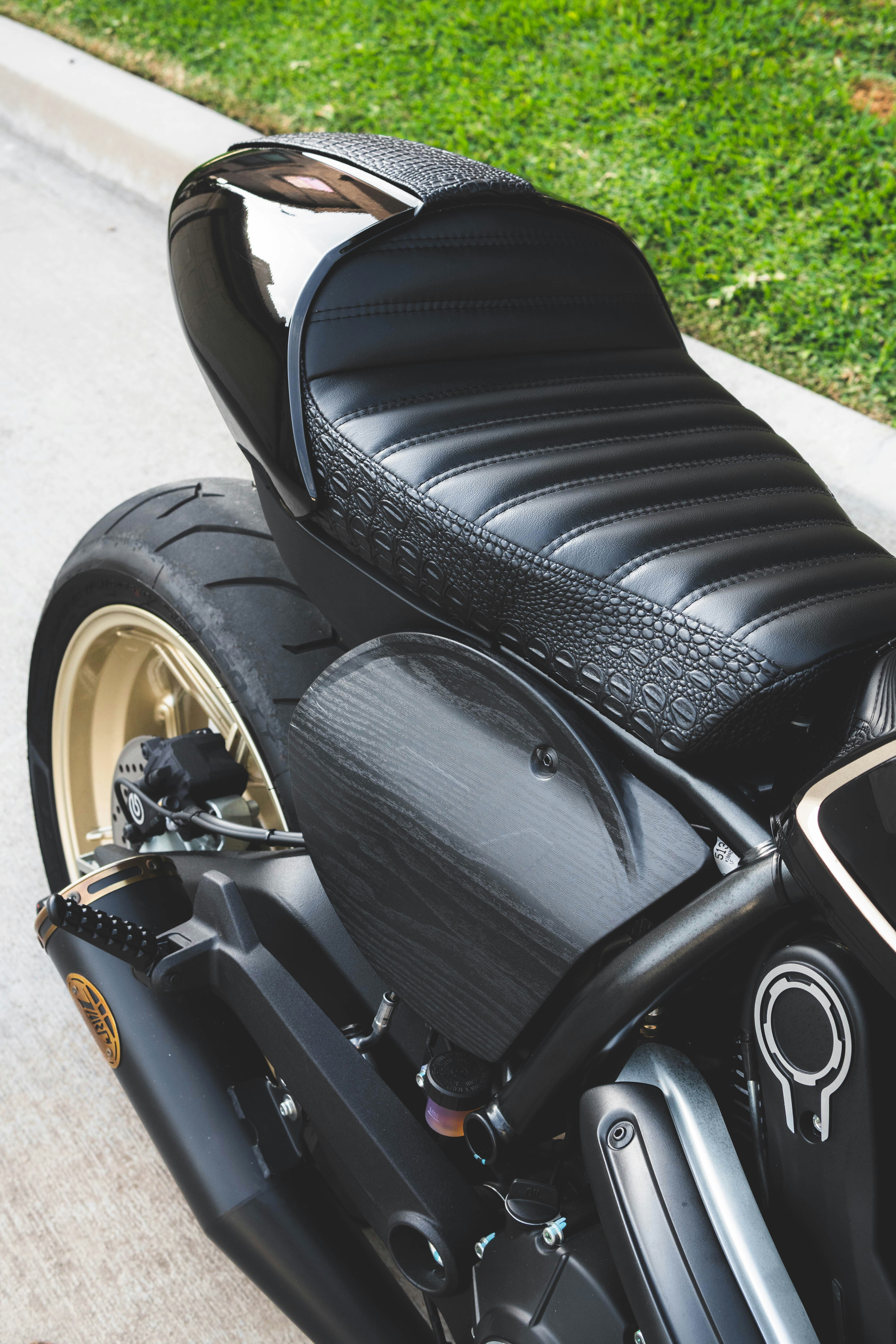 Ribbed Leather and Chrome: Close-Up on a Street Tracker Seat