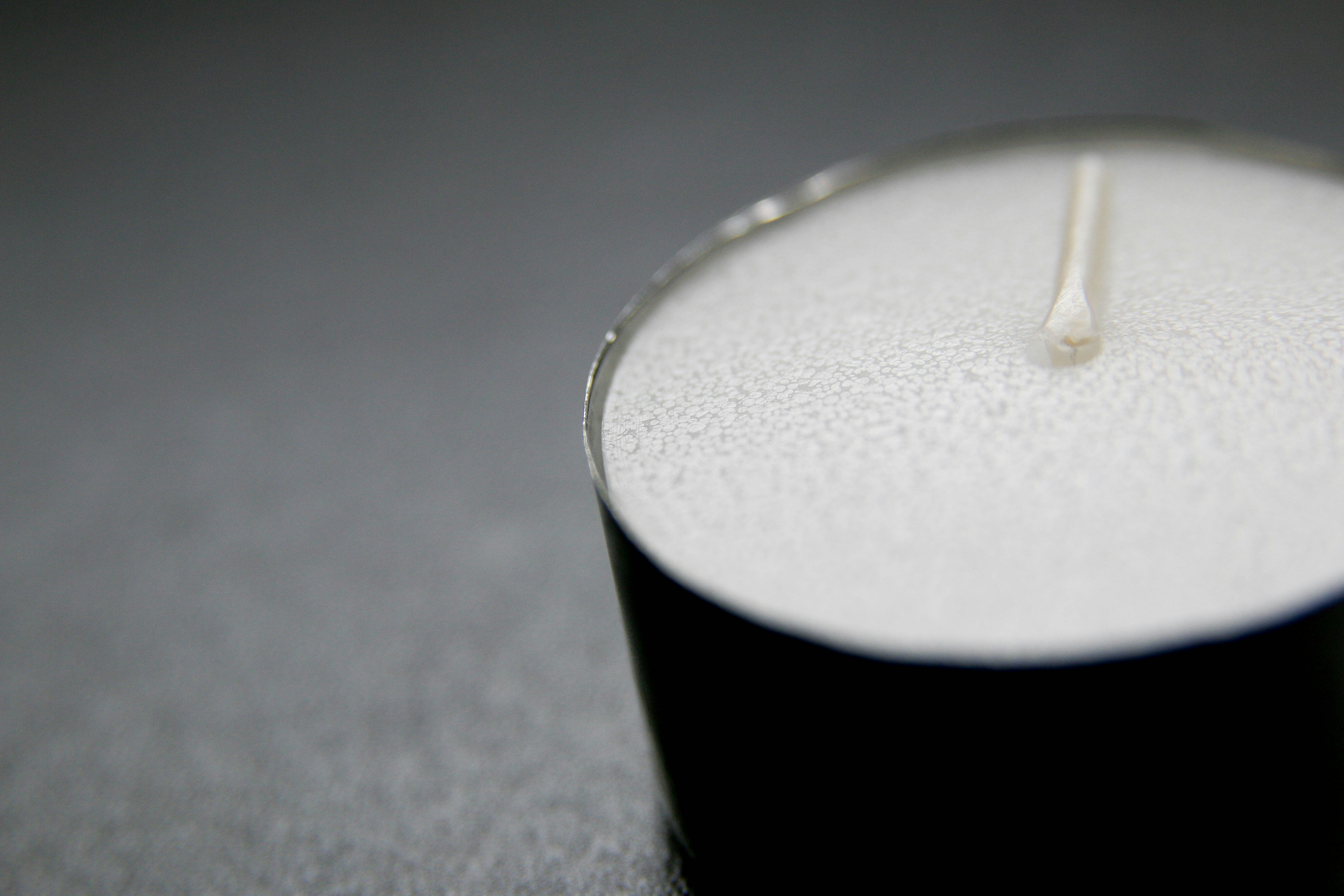 Minimal Glow: A Single Wick Above Quiet Matte
